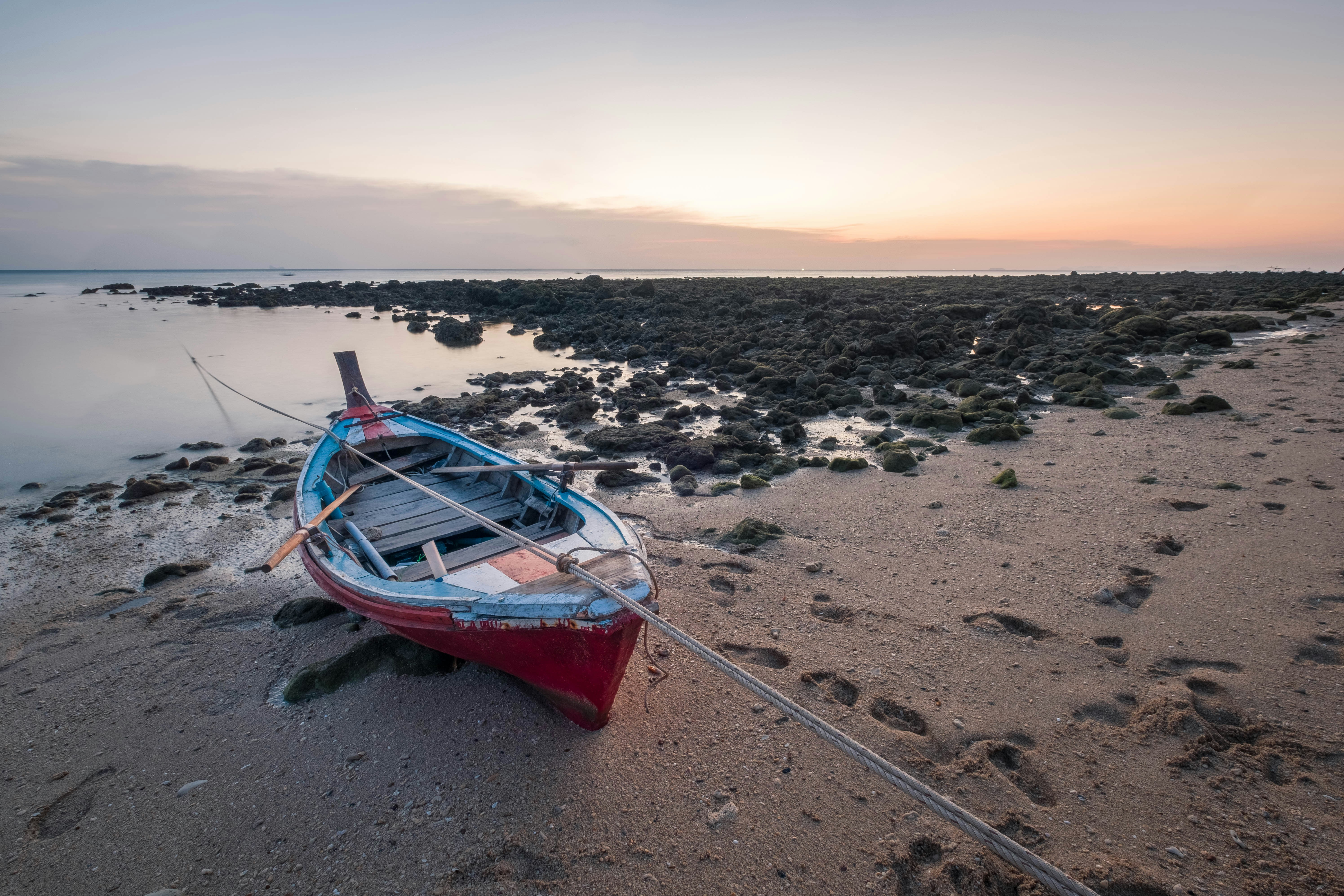Red Boat at Low Tide: A Quiet Edge of the Sea
