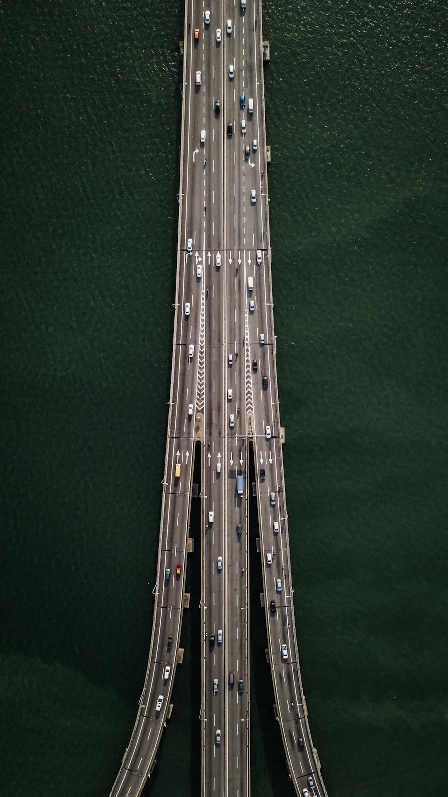 Busy morning traffic on the Penang Bridge | aerial view of bridge with cars crossing