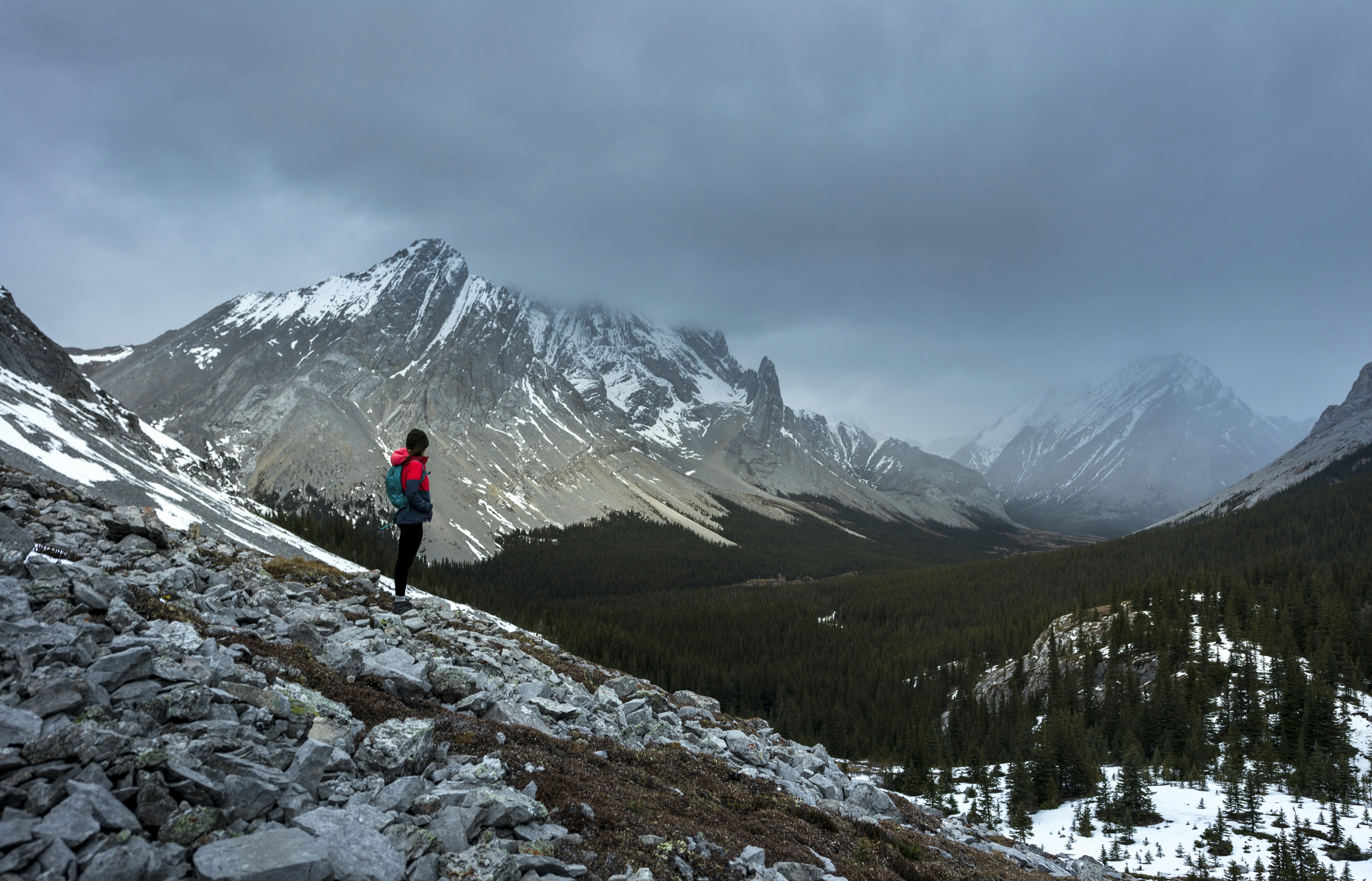 Lone Hiker on the Granite Spine Beneath Snow-Blue Peaks