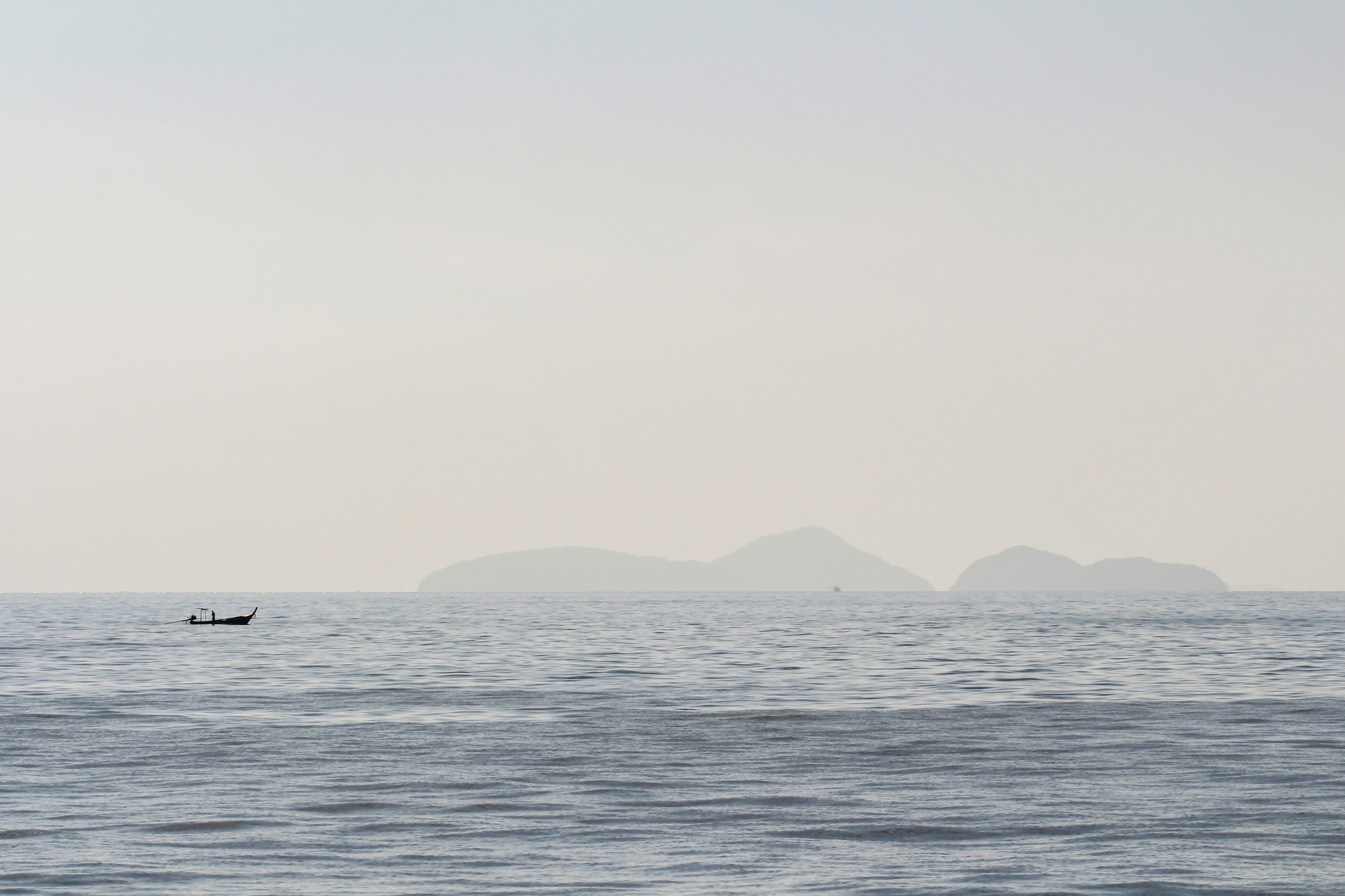 Lone Boat on a Misty Sea: Subtle Horizons and Quiet Light