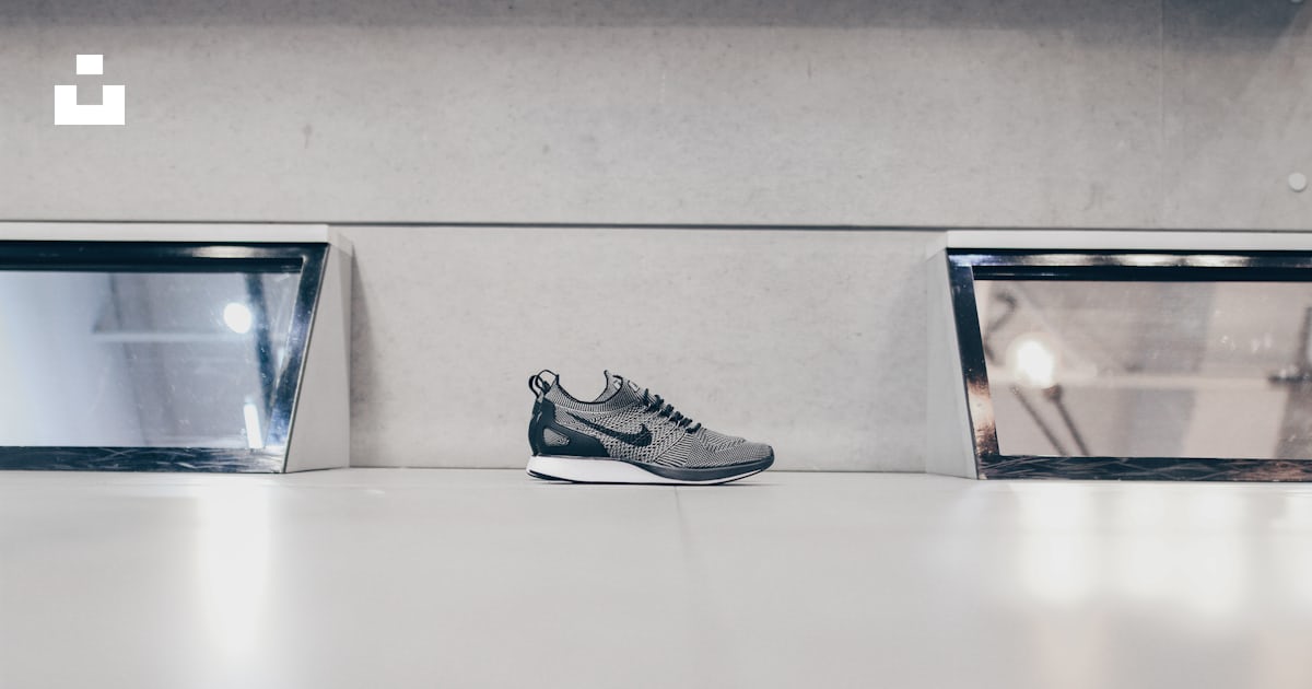 Unpaired black and gray Nike running shoe on floor photo – Free Shoe ... Unpaired black and gray Nike running shoe on floor photo – Free Shoe ...