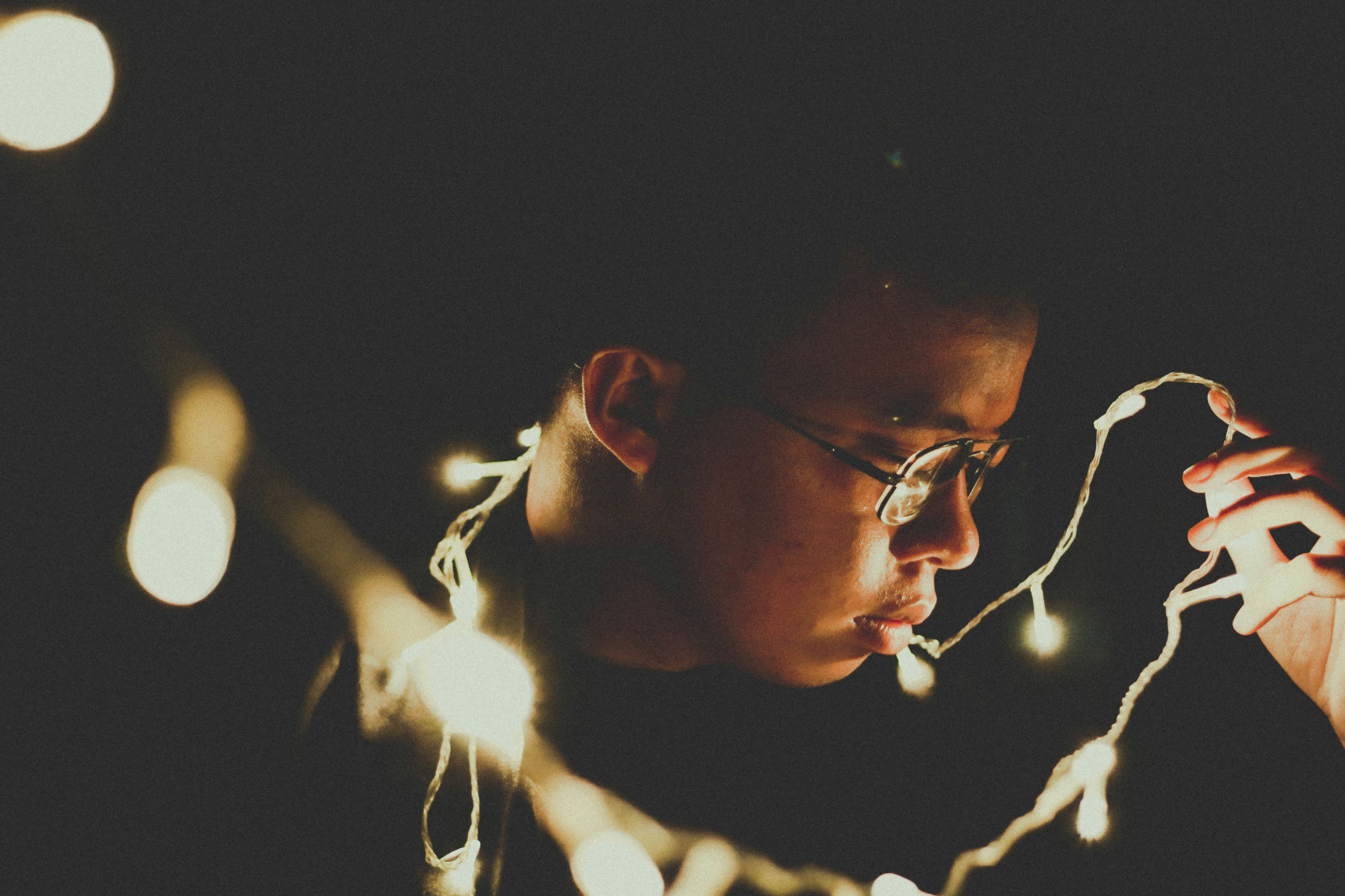 Man holding string lights photo – Free Man Image on Unsplash