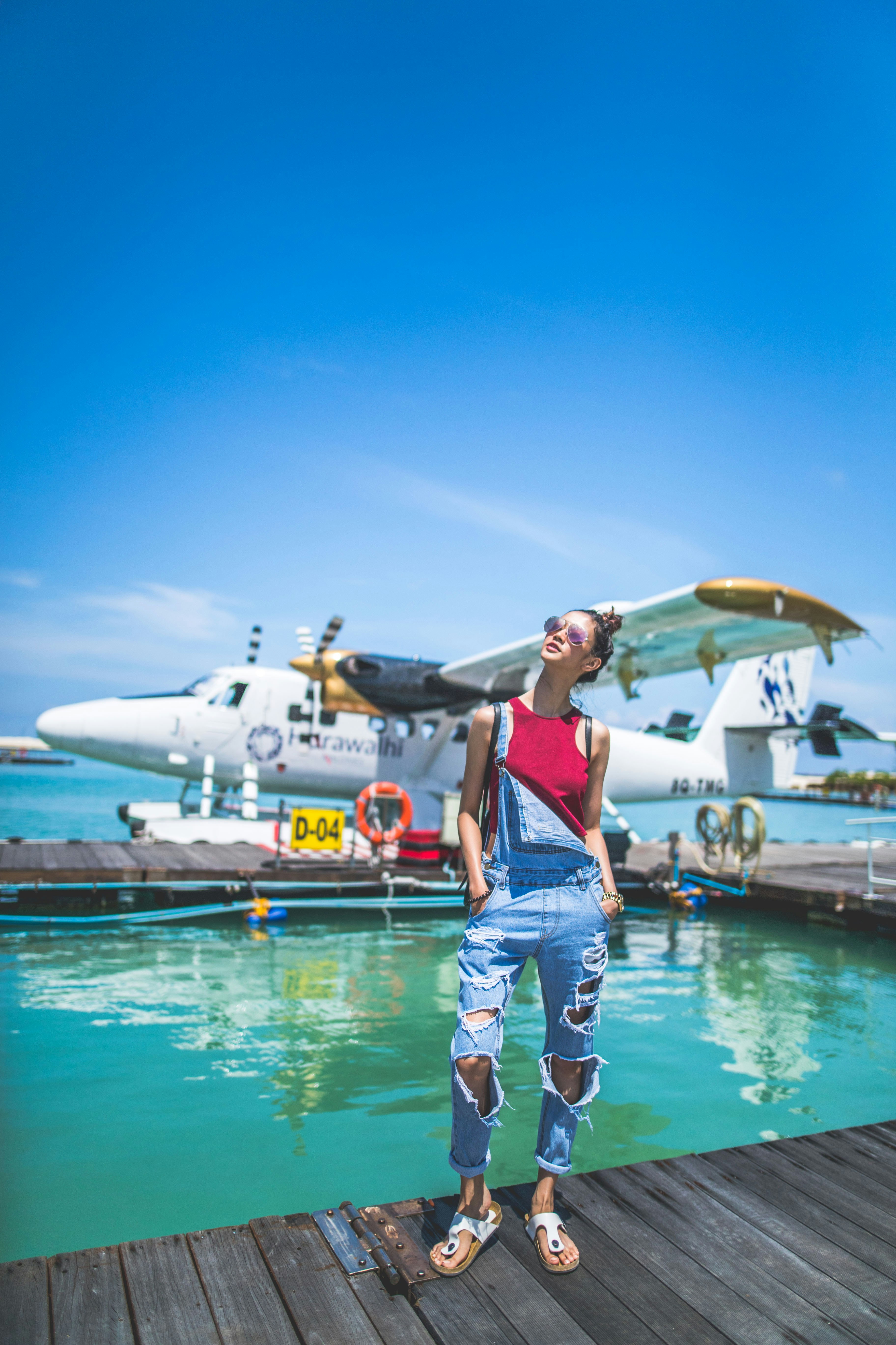 Sunlit Denim at a Seaplane Pier by Turquoise Waters