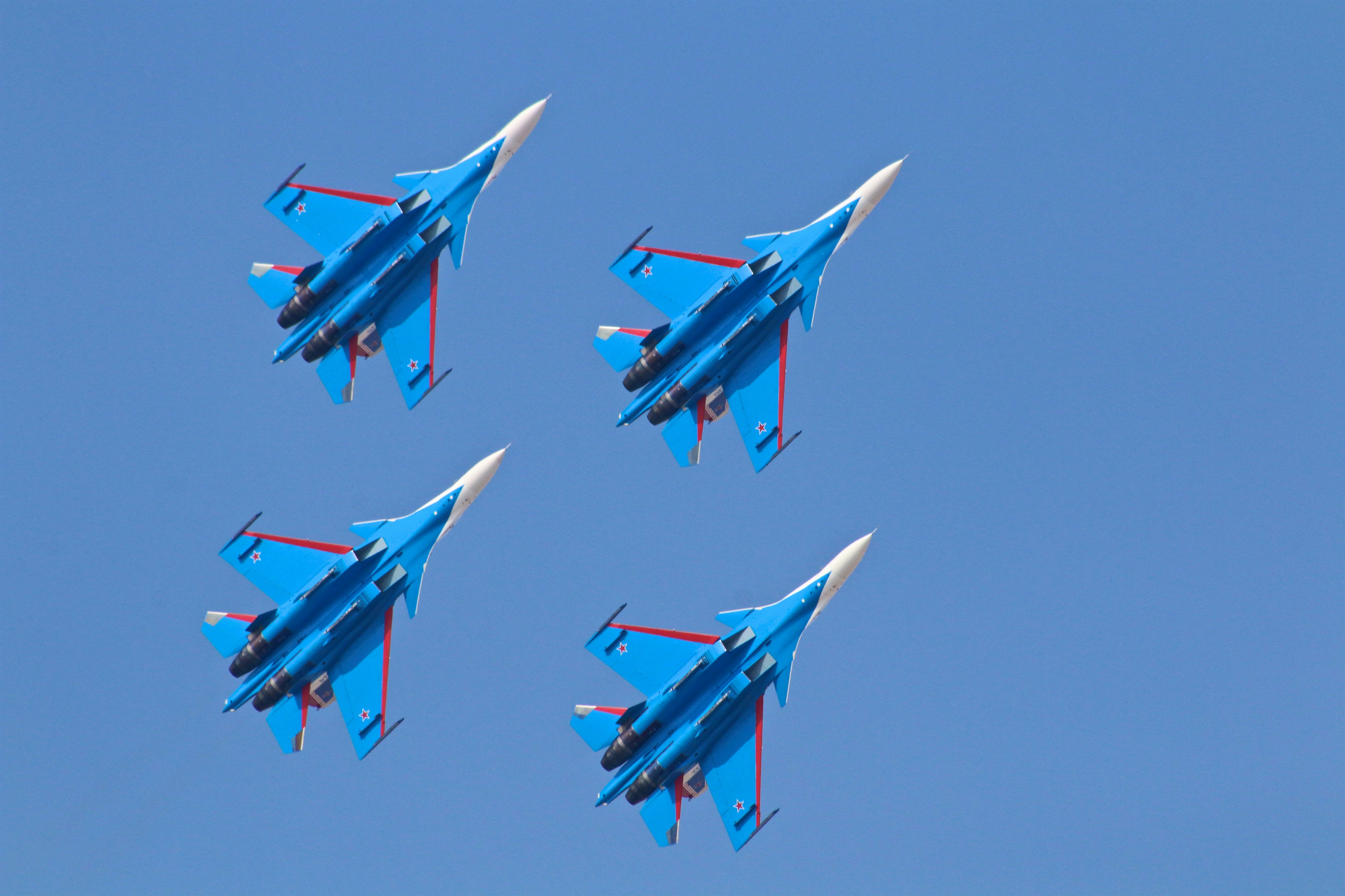 Four blue fighter planes under blue sky photo – Free Blue Image on Unsplash