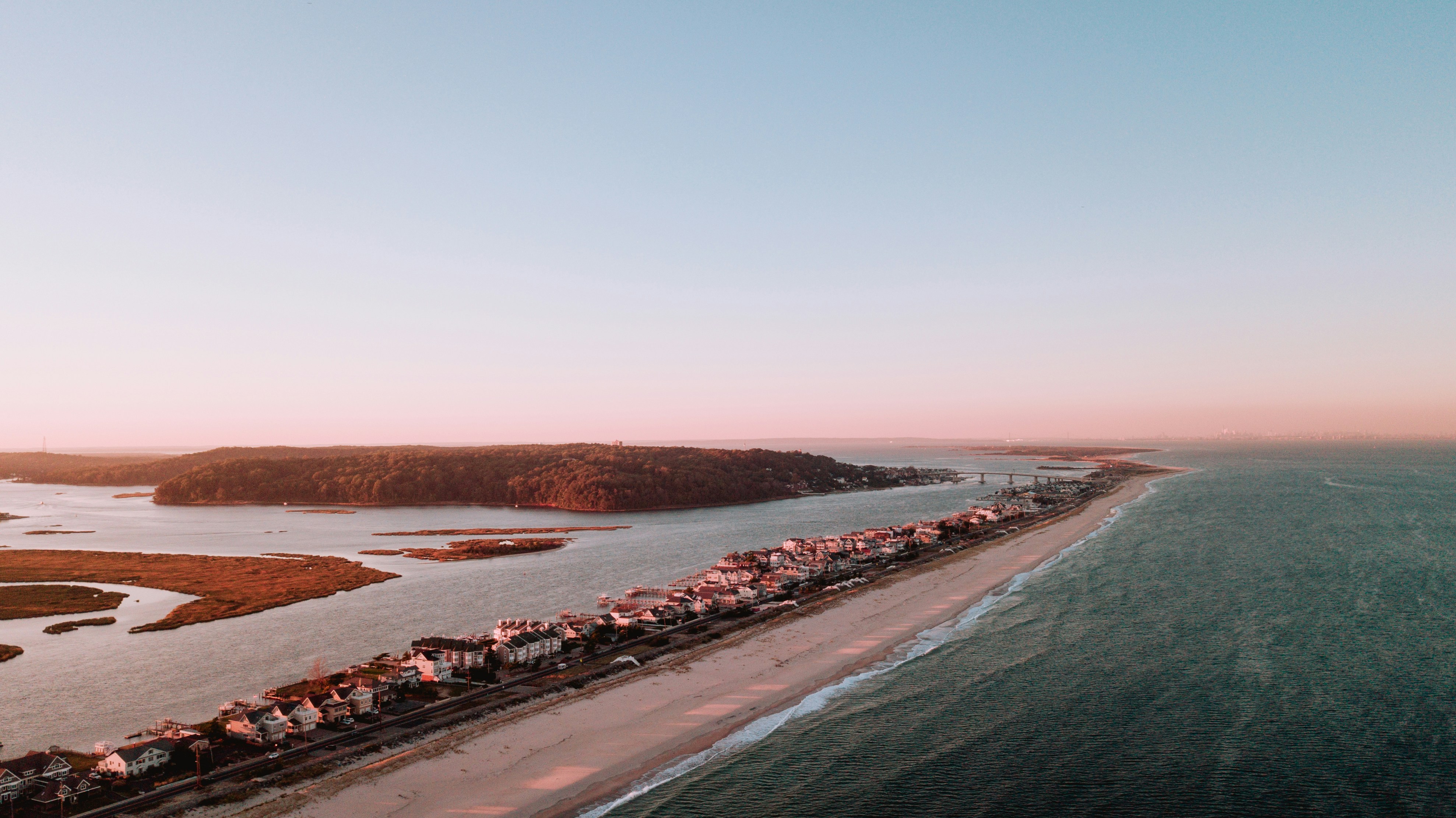 Golden Horizon Over Coastal VillageRyan Loughlin