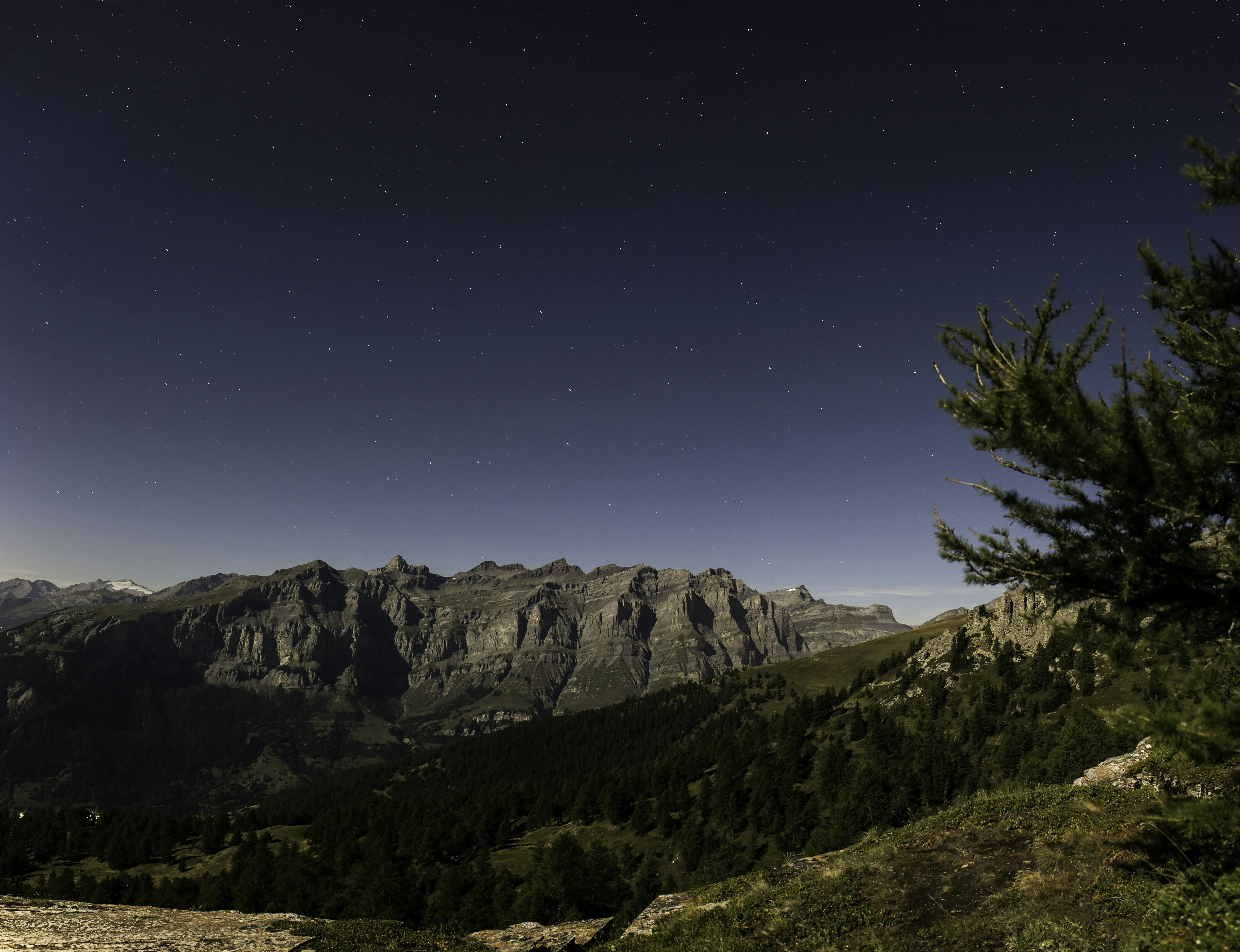 it was around 2 o’clock in the moring when I took this shot. the moon enlightened the whole valley of valais. i took three single shots and merged them together in post.
