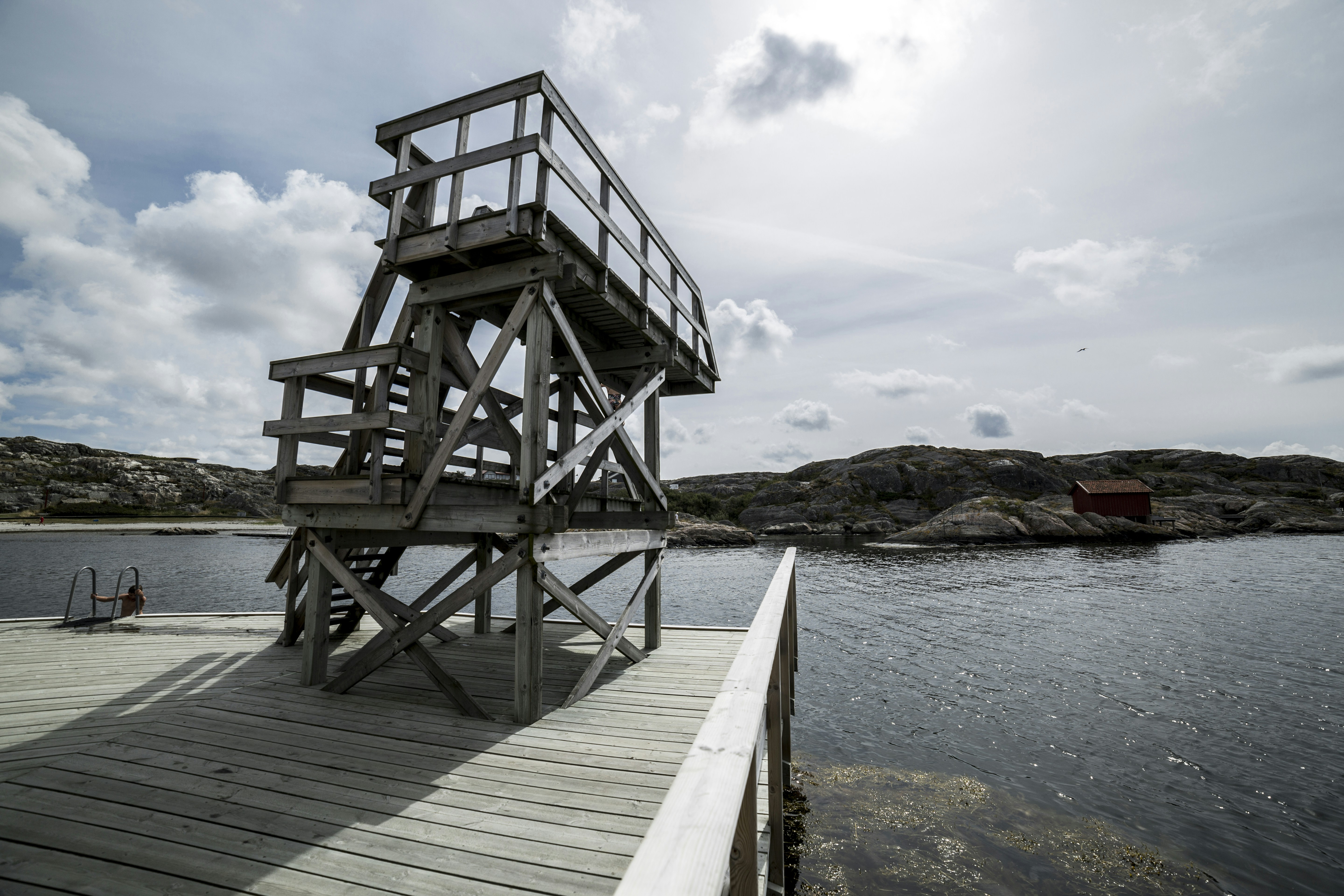 Weathered Lifeguard Tower Anchored to a Quiet Coastal Pier