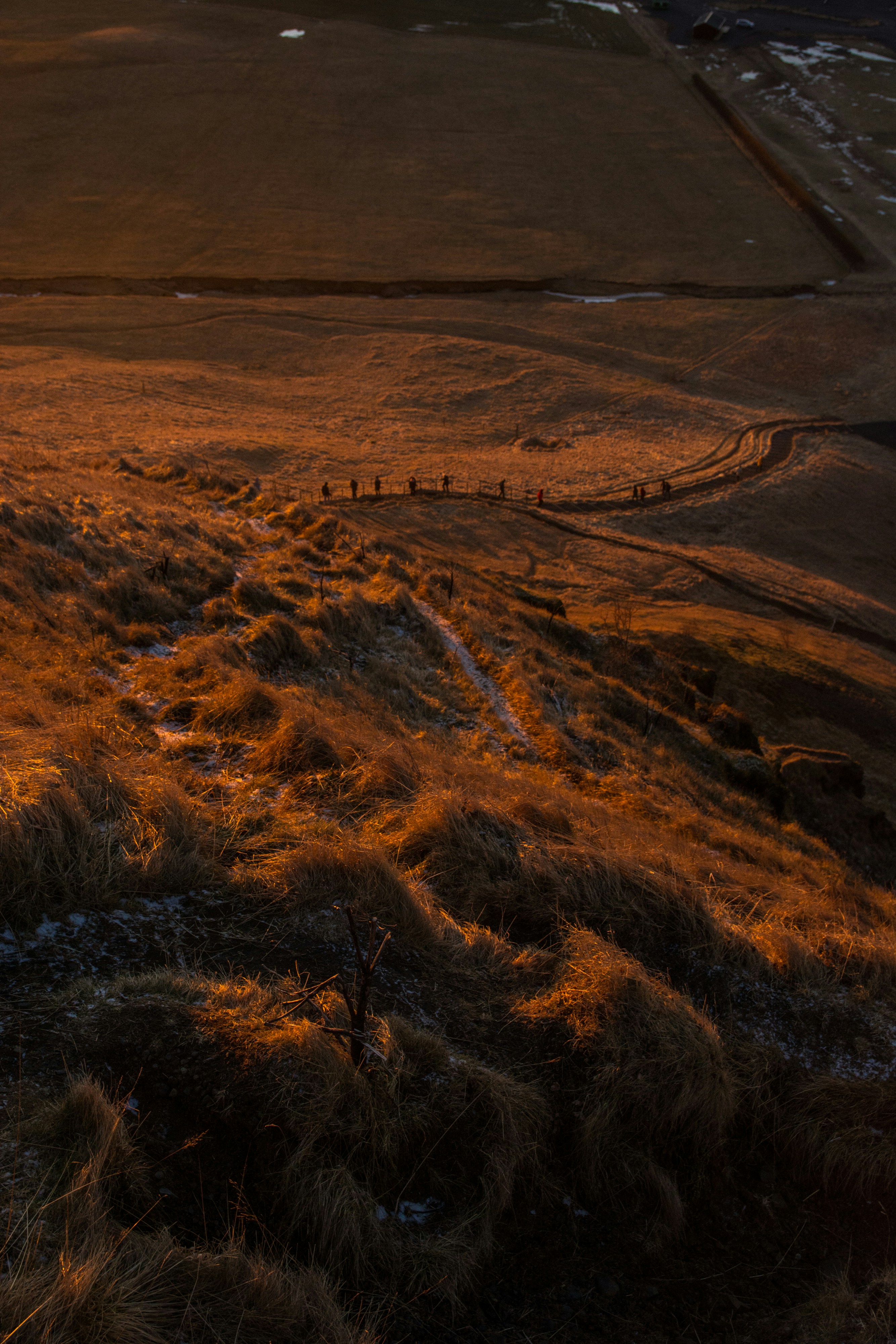 Dusk-Burnished Ridge: A Quiet Fence Tracing the Hillside