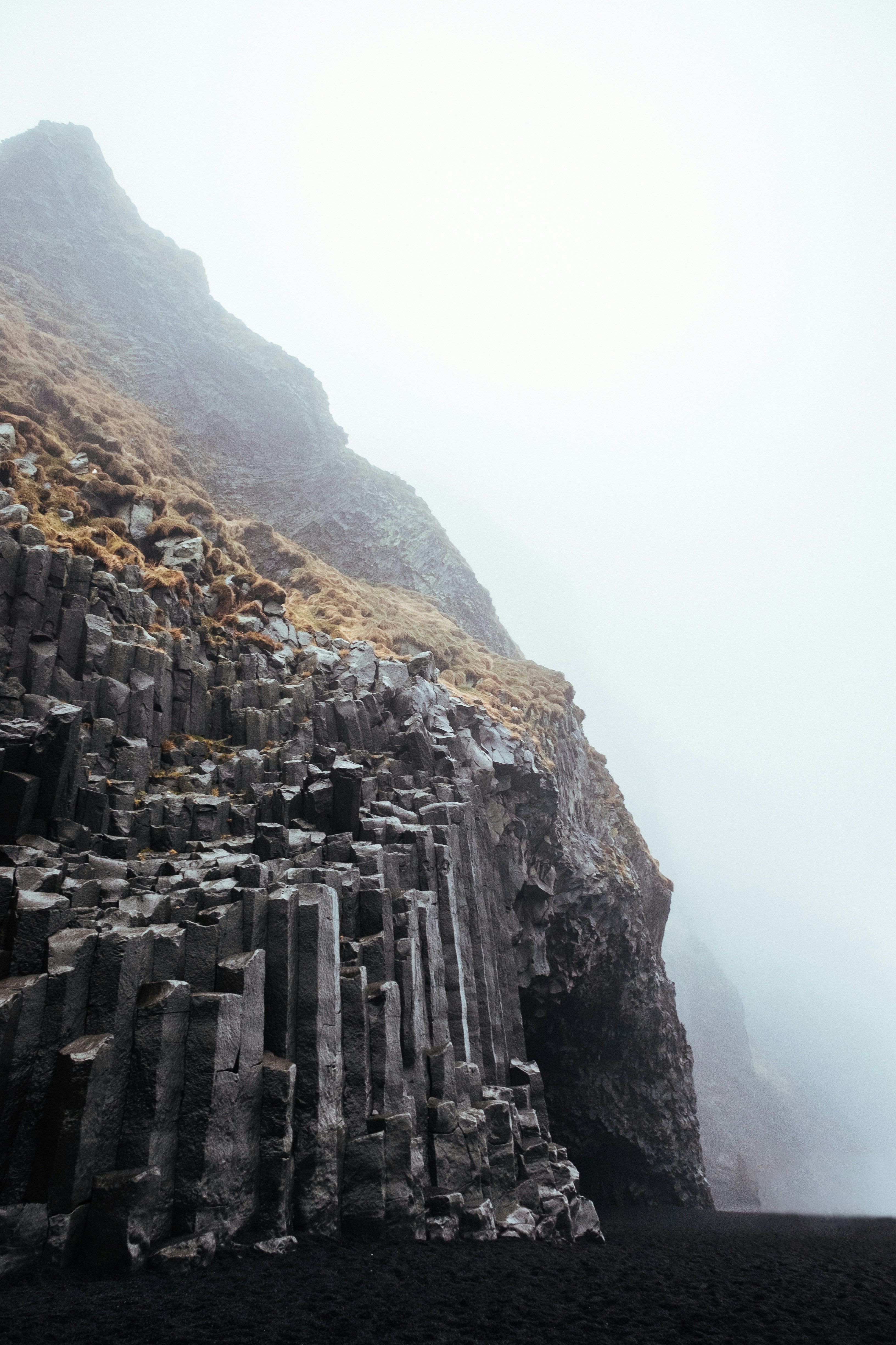 Gray cliff under white cloud blue skies photo – Free Iceland Image on ...