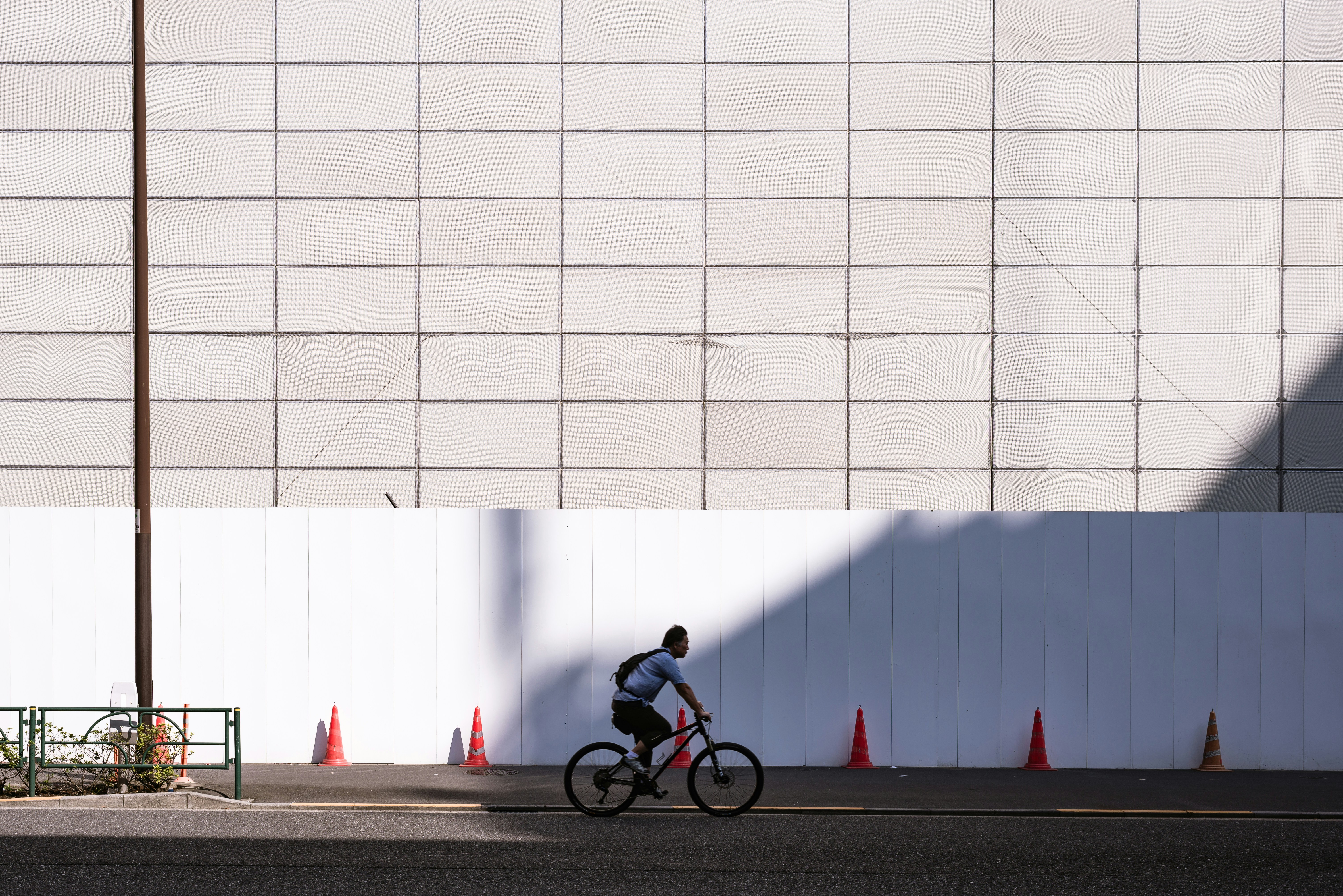 Man riding bicycle near white wall during daytime photo – Free Street ...