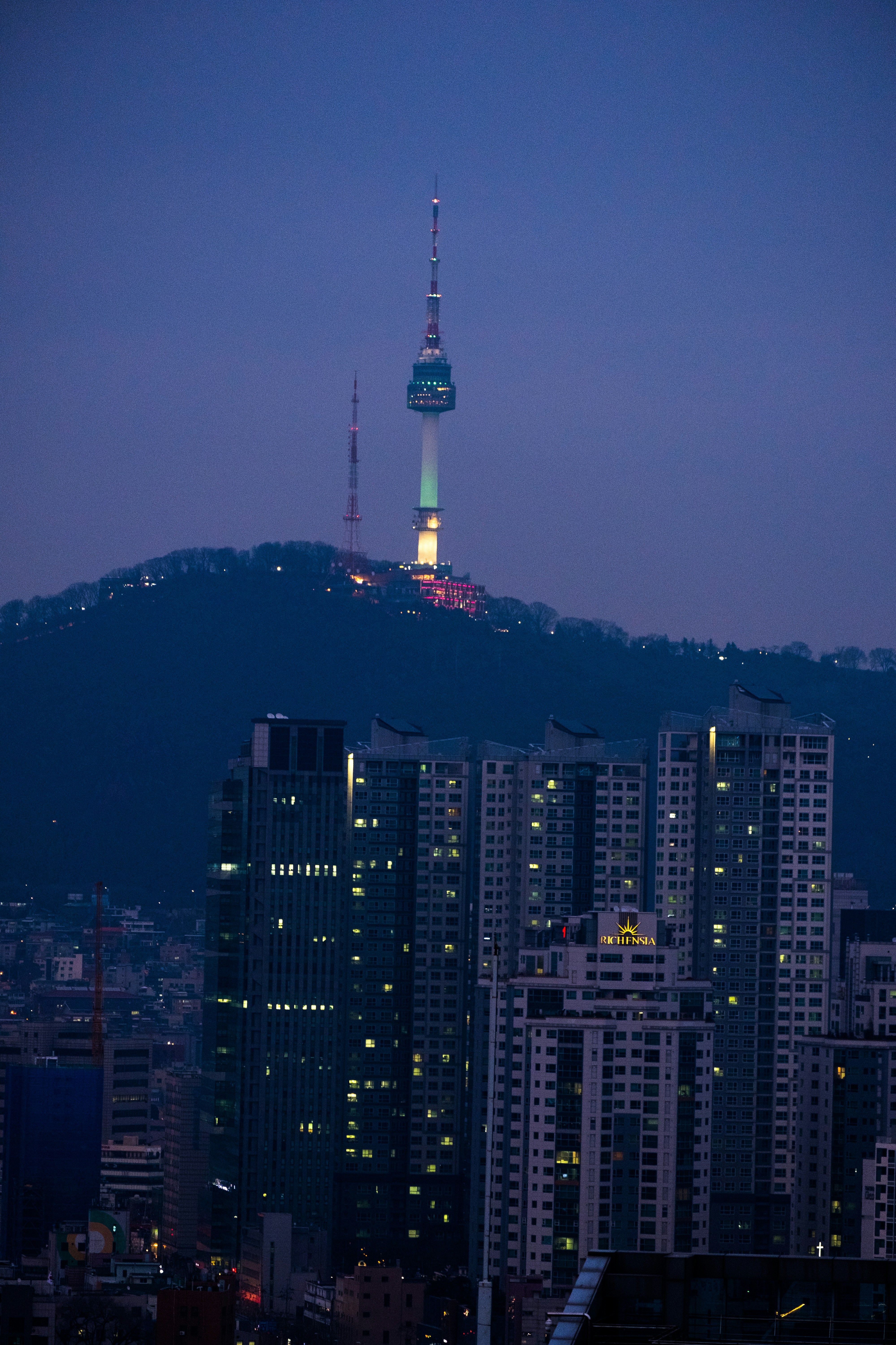 Illuminated Apex Above the Cityscape