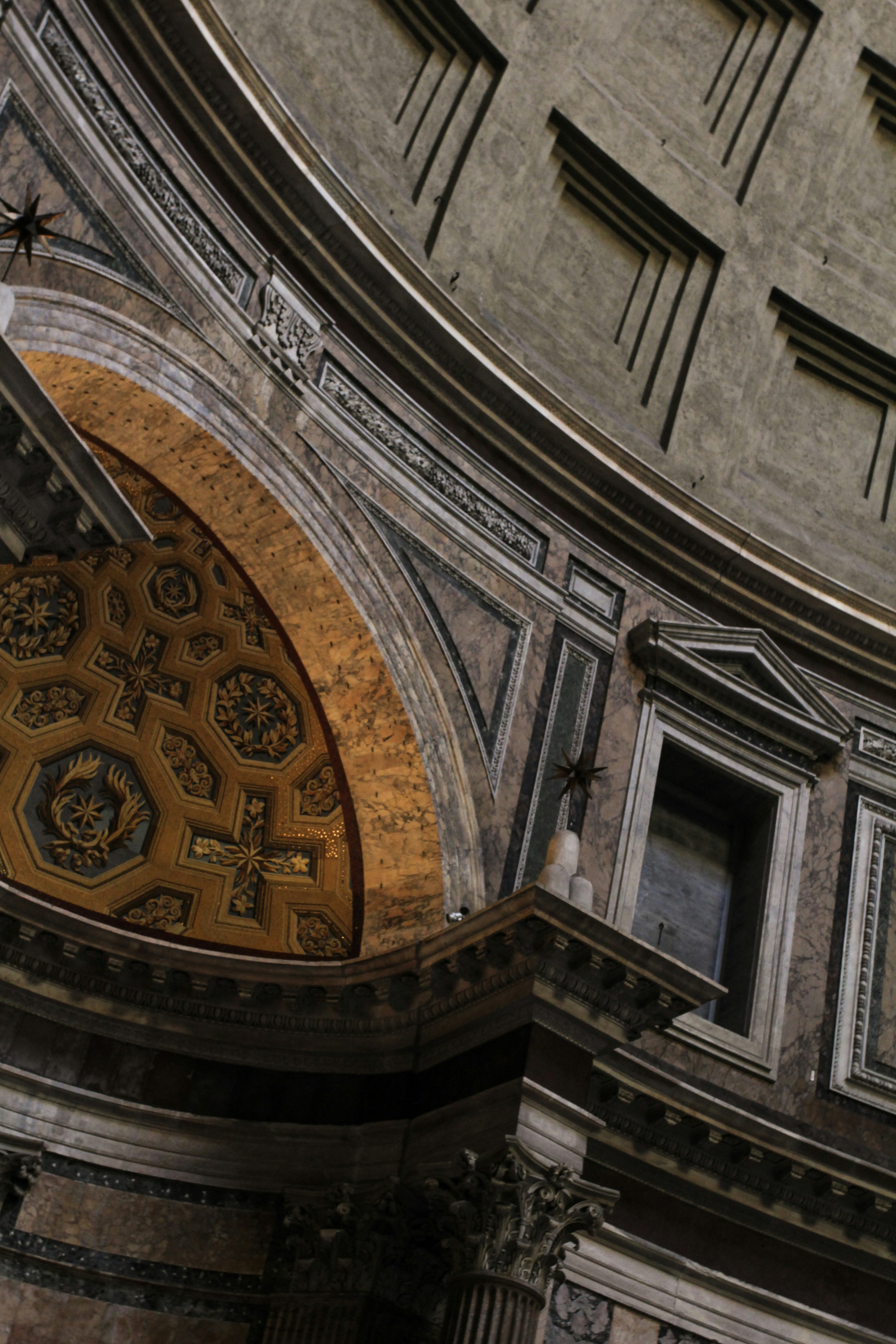 Intricate details of the Pantheon's dome, showcasing ornate patterns and textures in a historical architectural marvel.