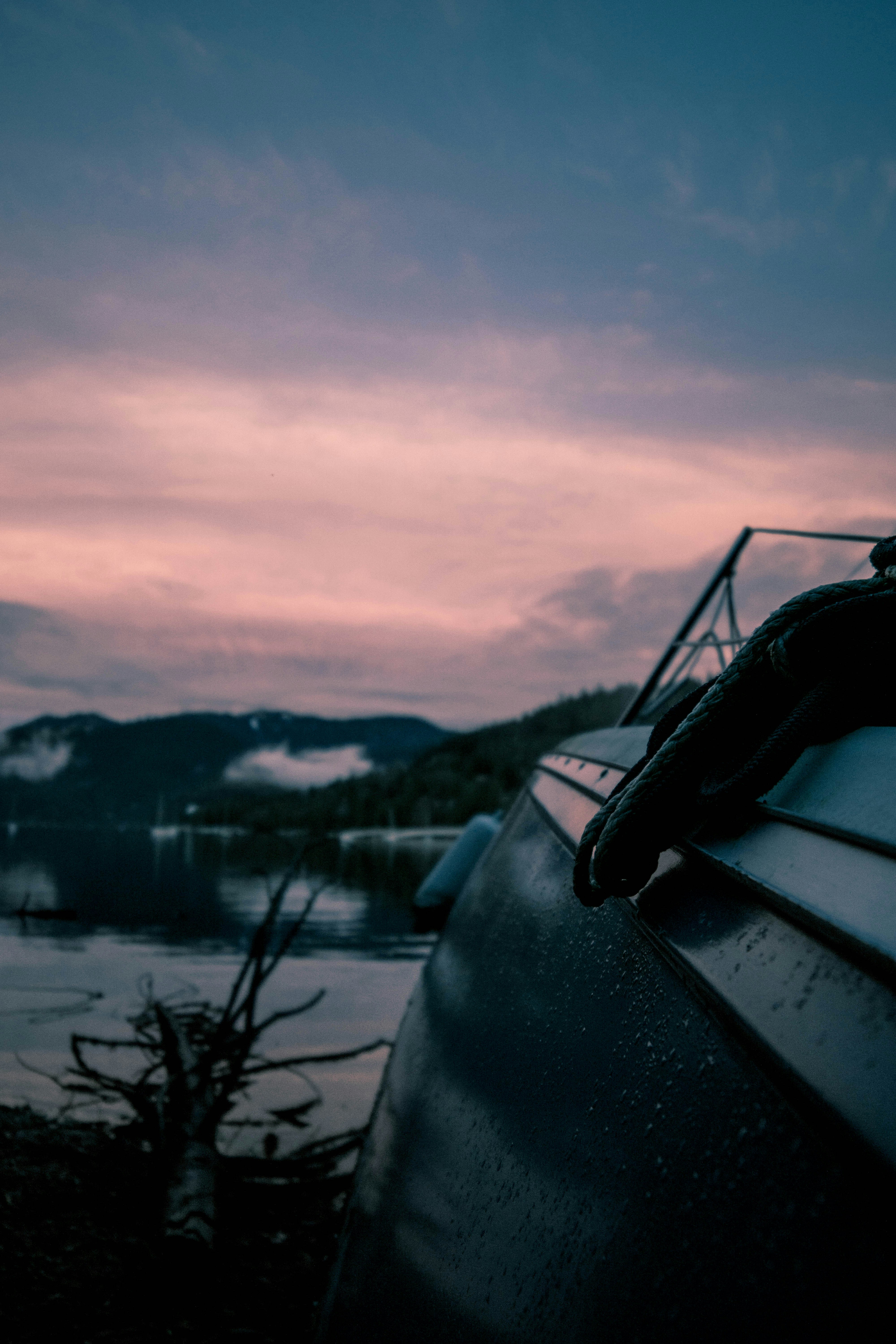 Bow at Dusk: A Quiet Vessel Under Pink Twilight