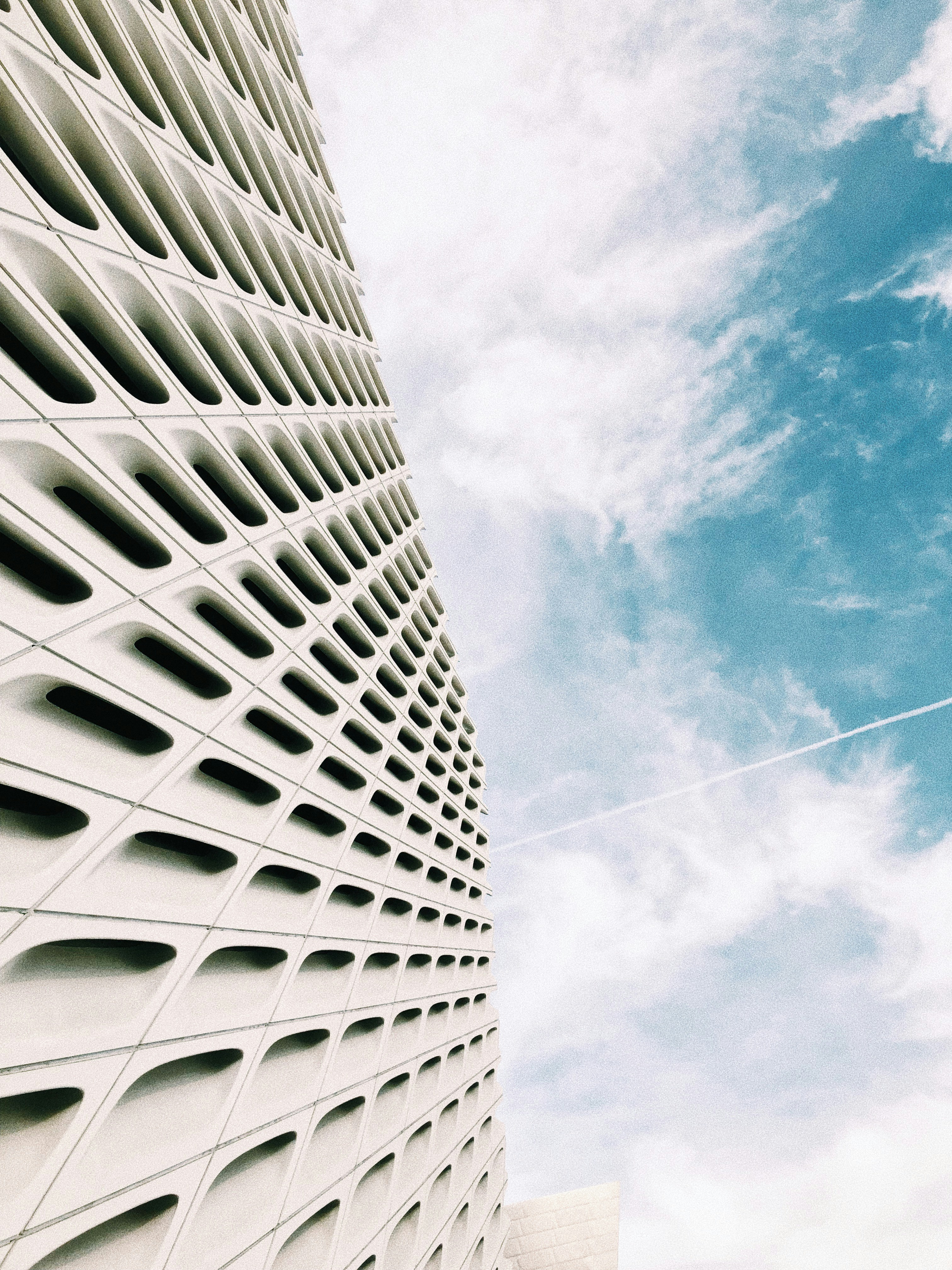 Echoes of the Facade: A Tilted Grid Reaching Toward the Sky