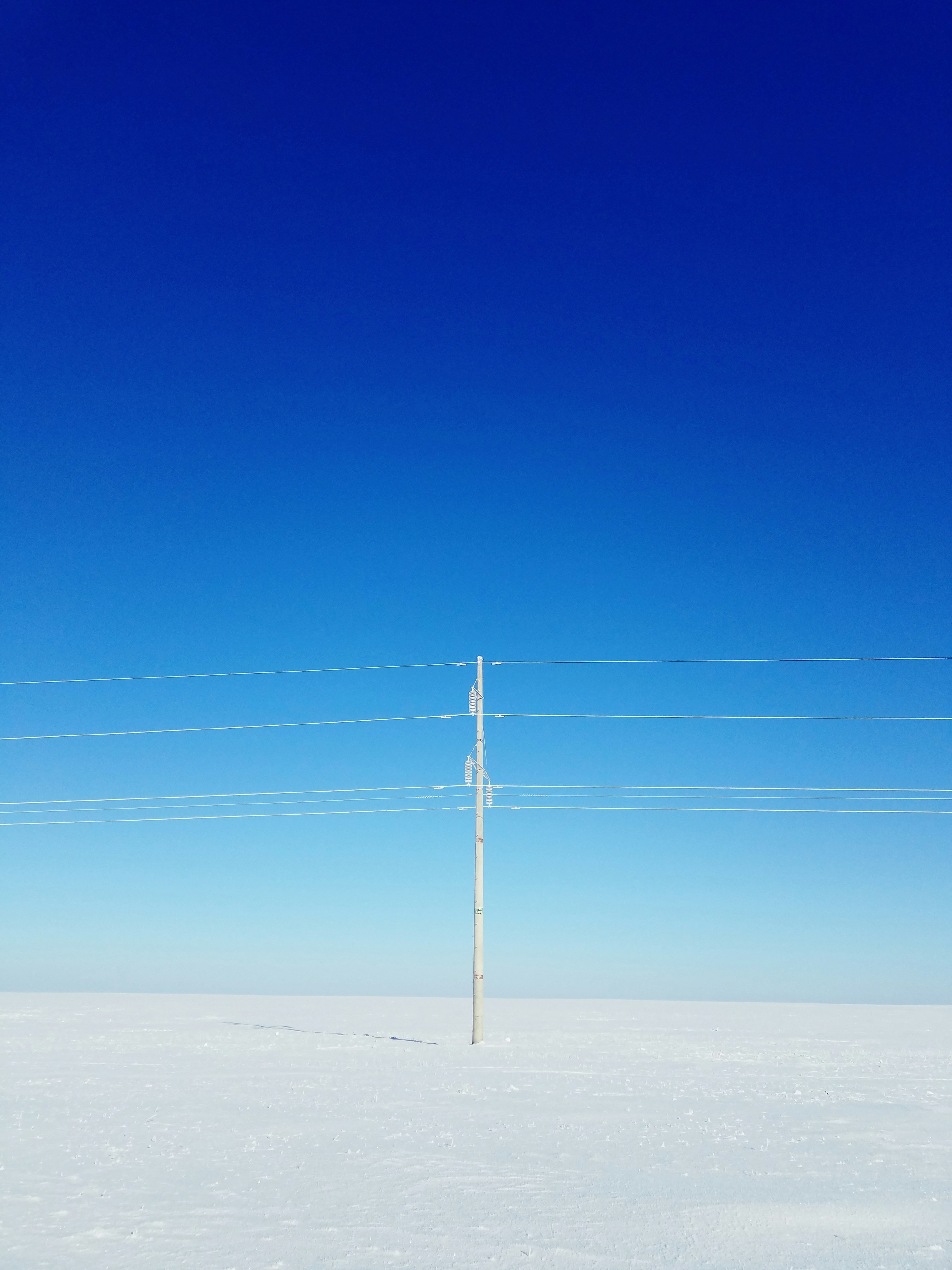 White electric post photo – Free Blue Image on Unsplash