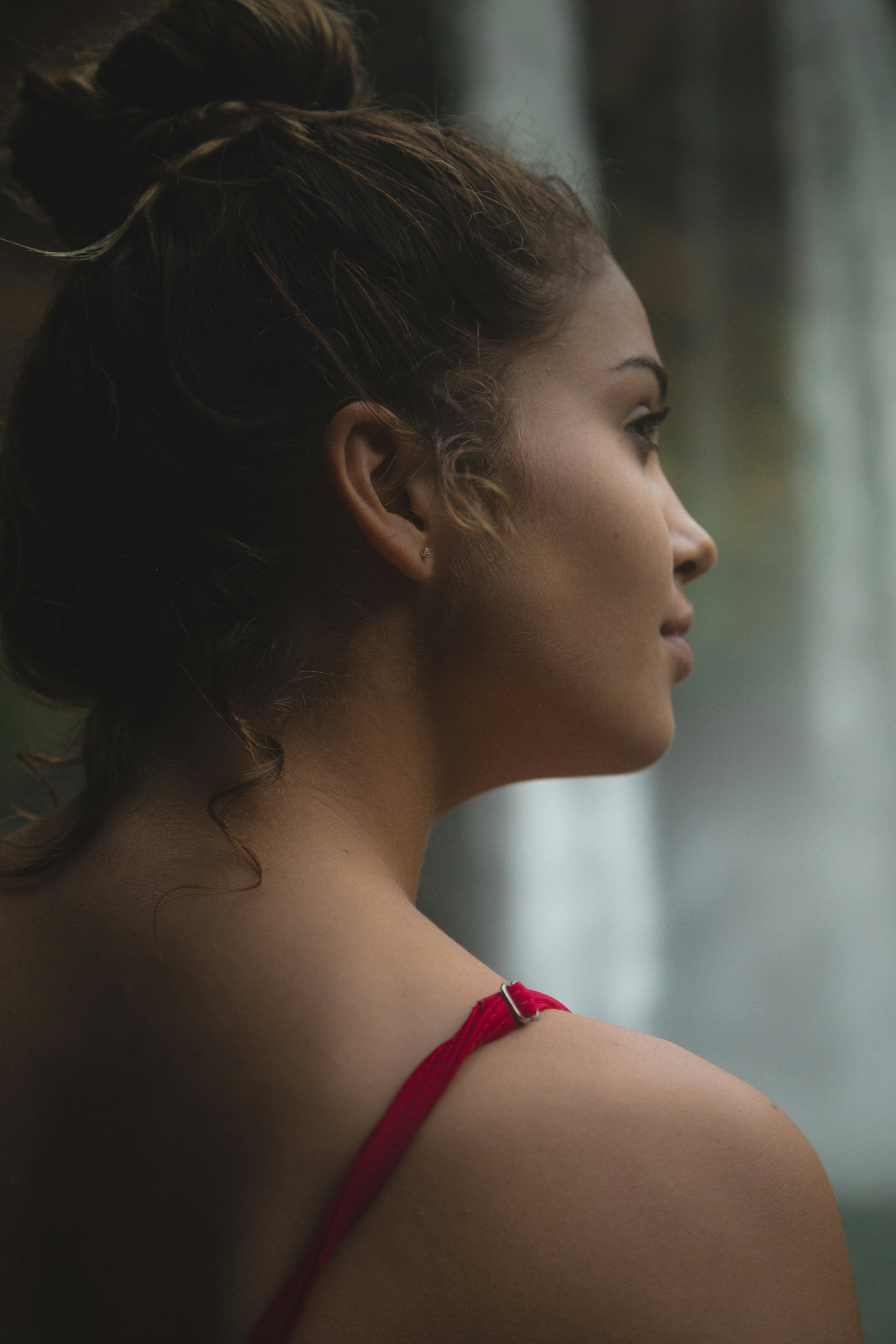 Profile in Soft Light: A Woman at the Edge of a Waterfall