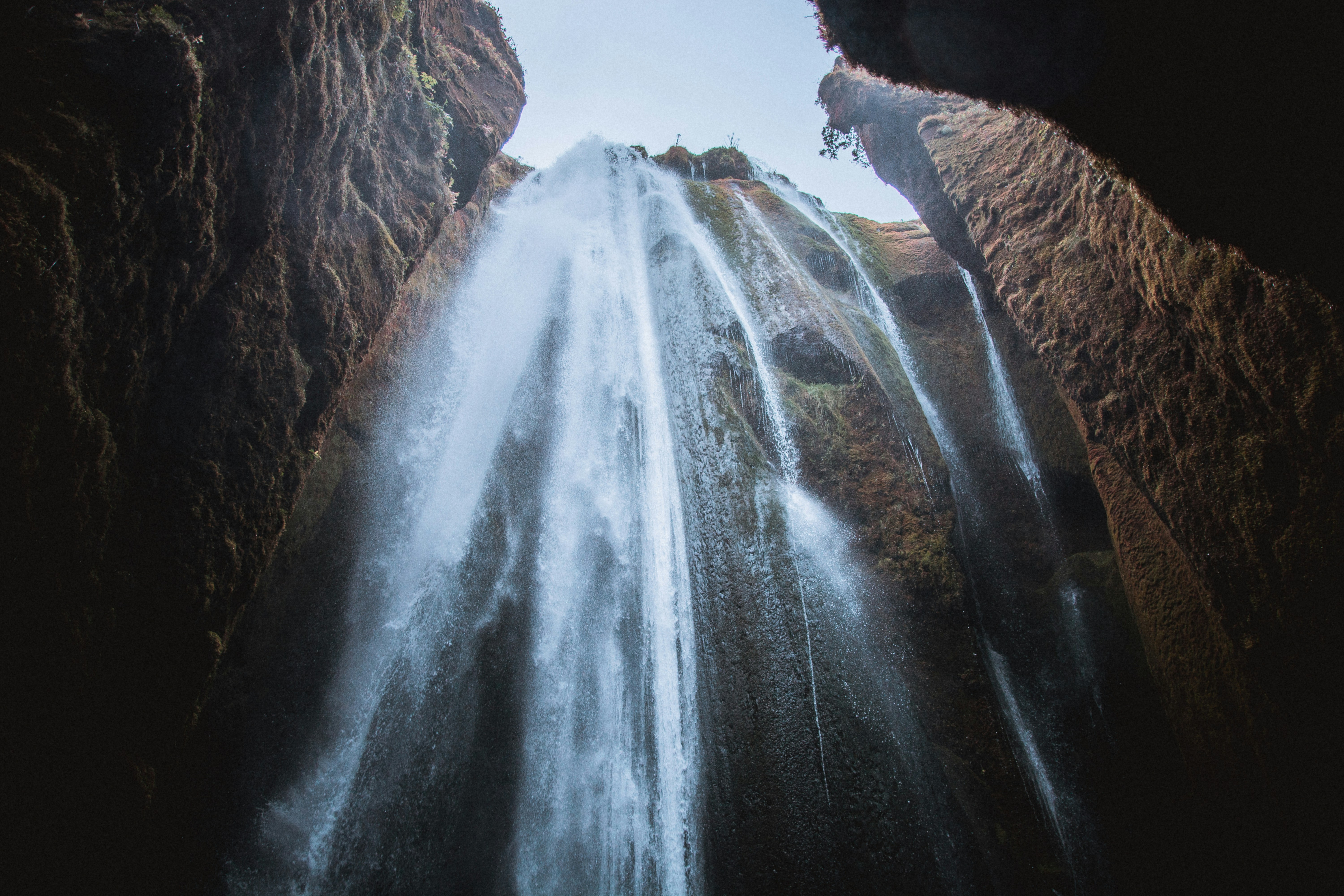 Worm's eye view of waterfalls photo – Free Cave Image on Unsplash