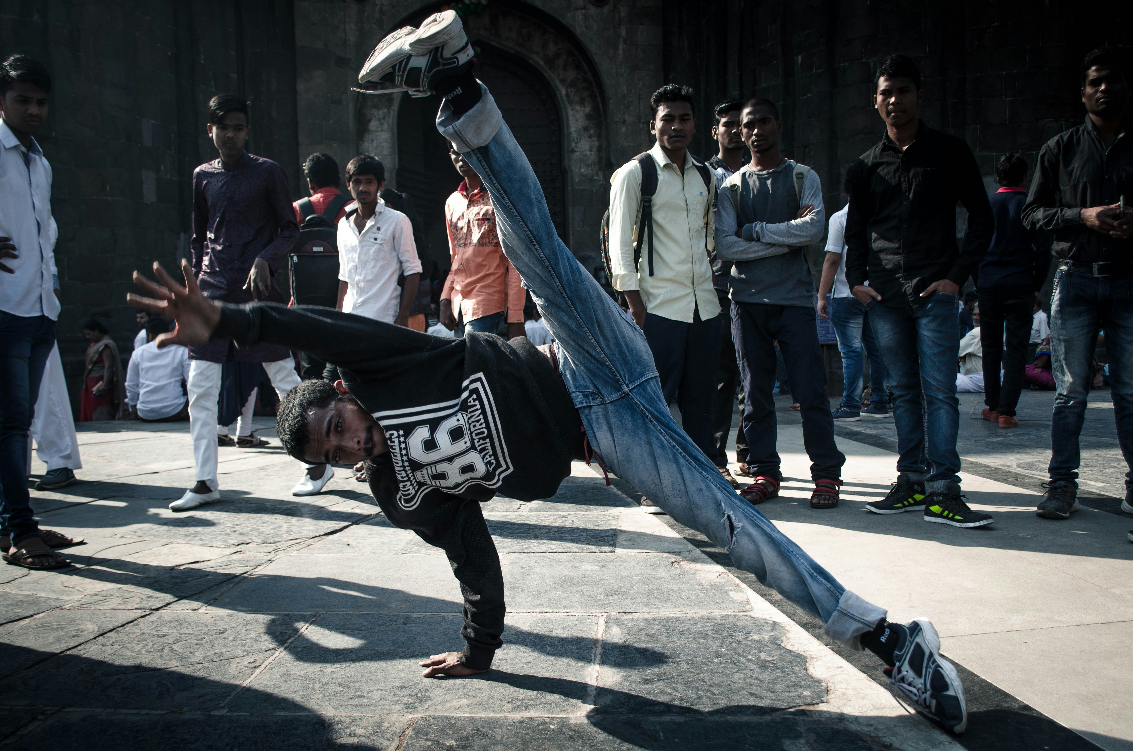 Limit of Movement | man dancing outdoors surrounded by crowd of people