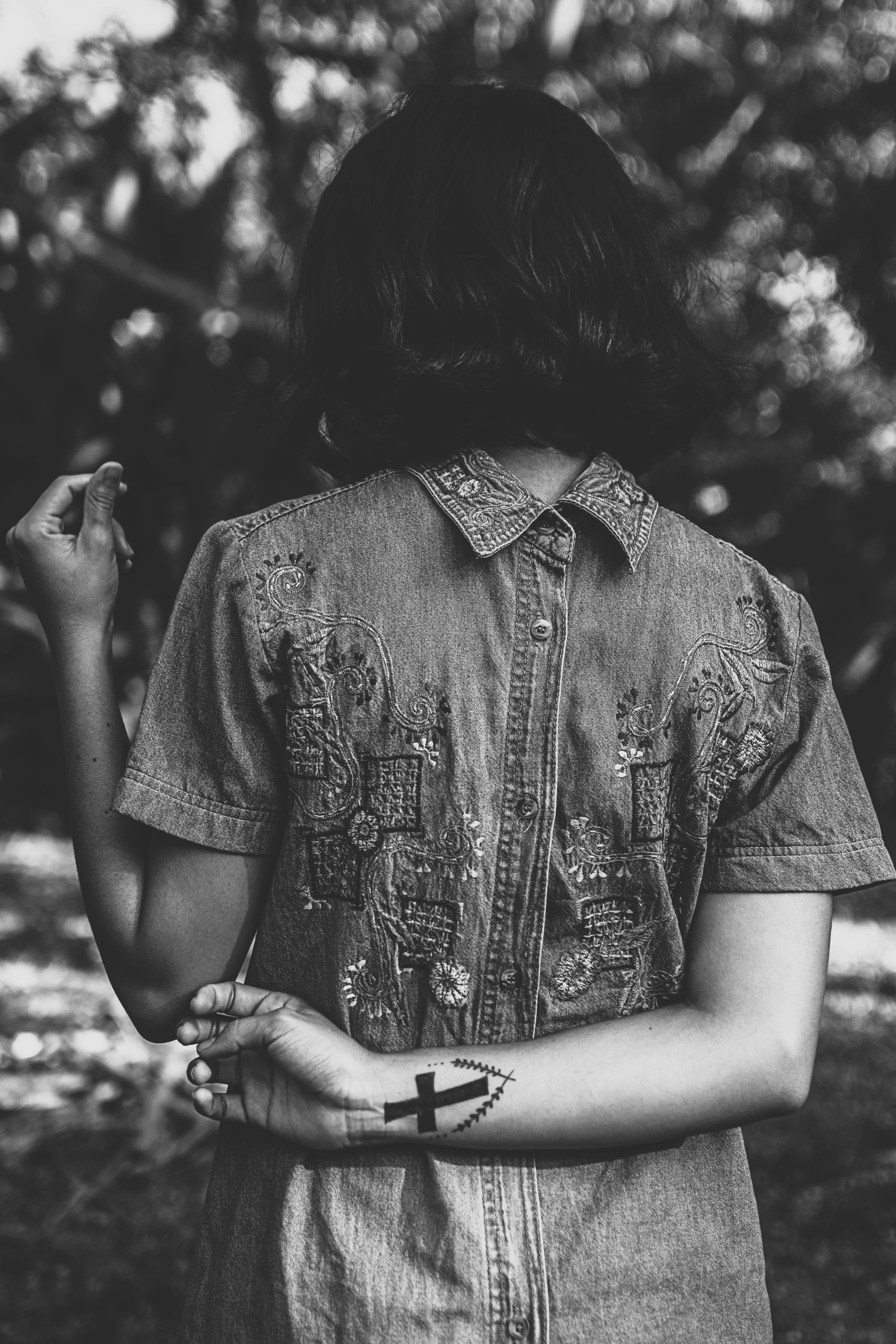Gray scale photo of a woman standing in front of bushes photo – Free ...