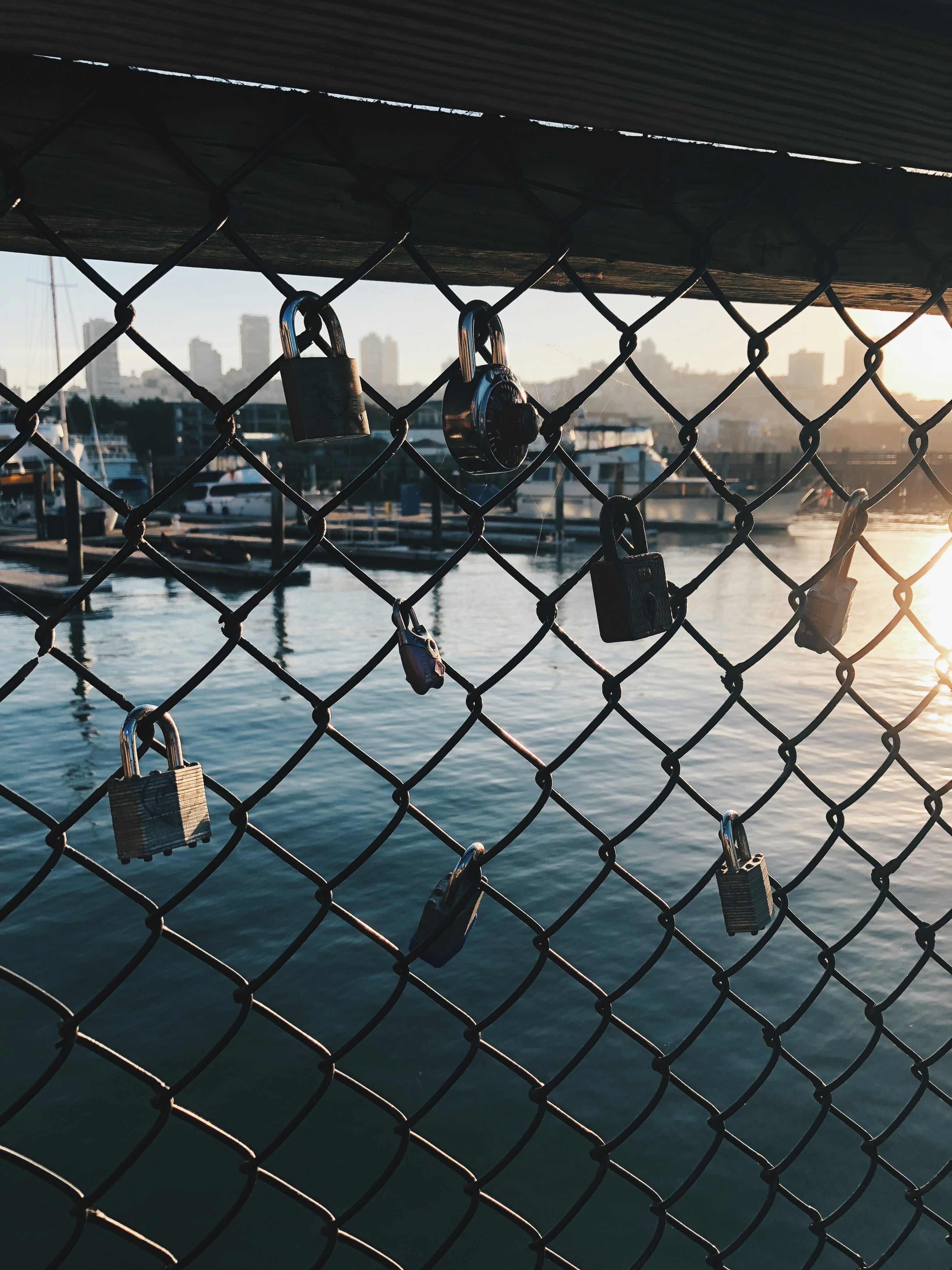Gray chain link with padlock over body of water photo – Free Grey Image ...