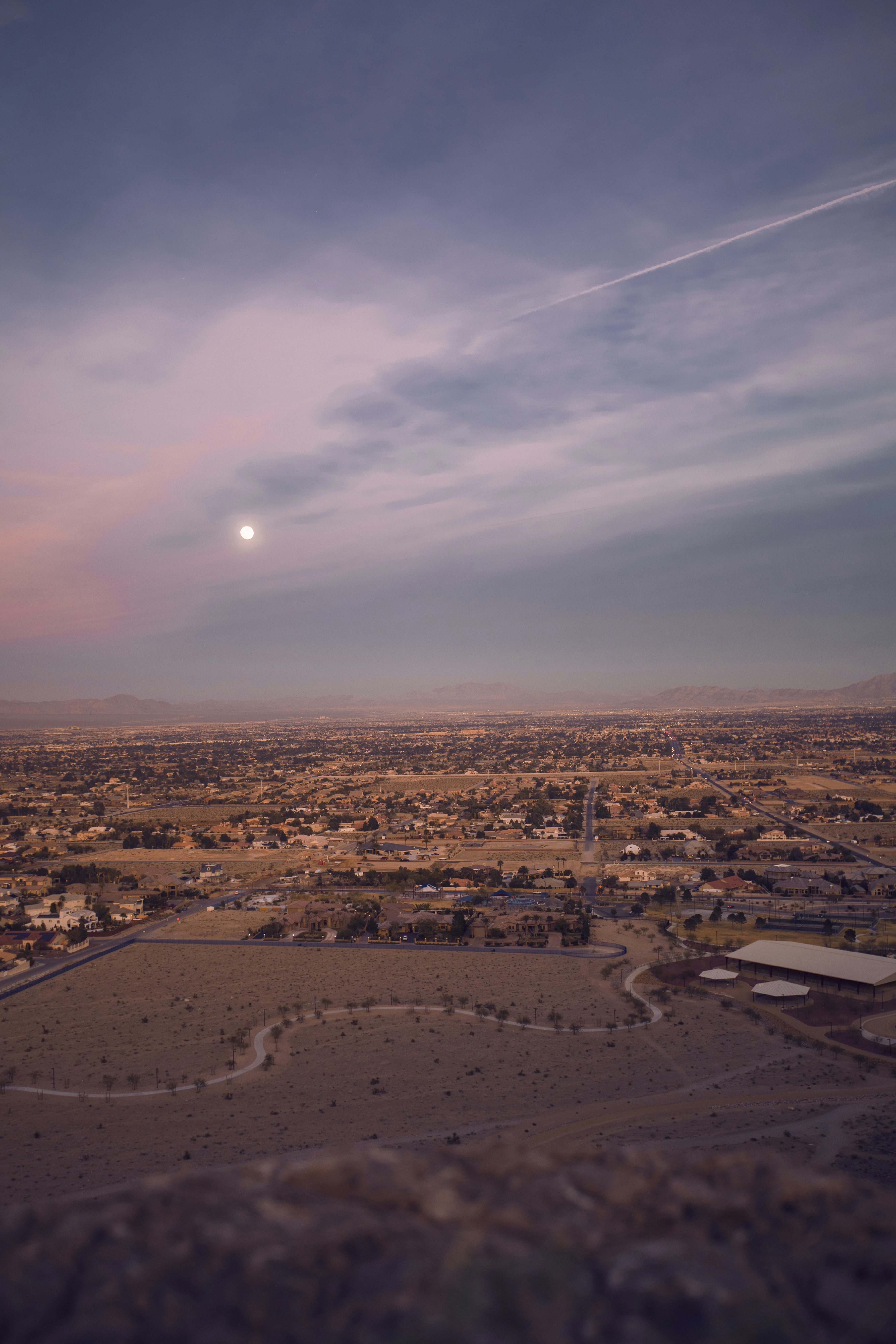 Moonrise Over a Quiet Desert Suburb at Dusk