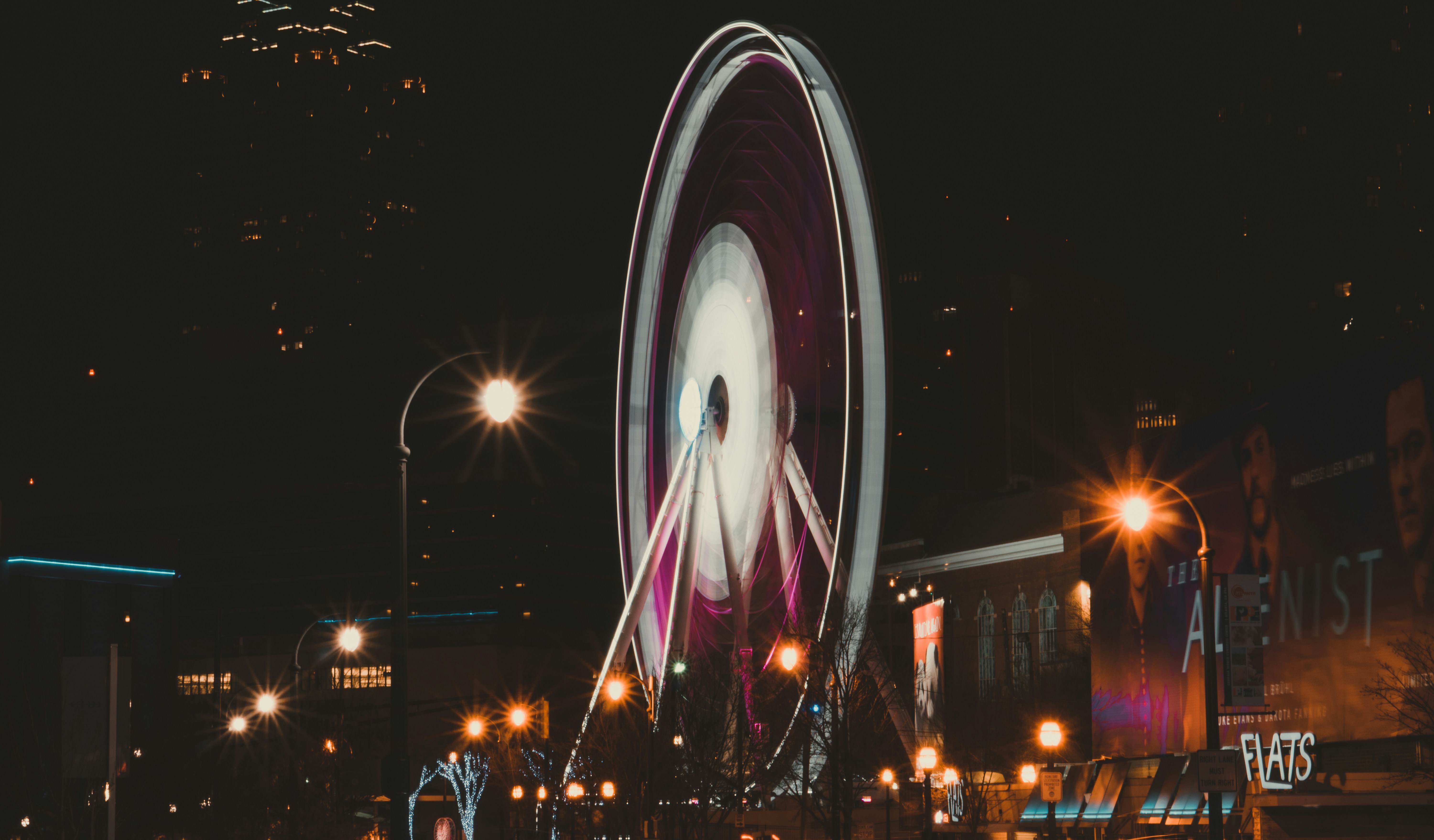 Neon Ring Over Night City: Ferris Wheel in Motion