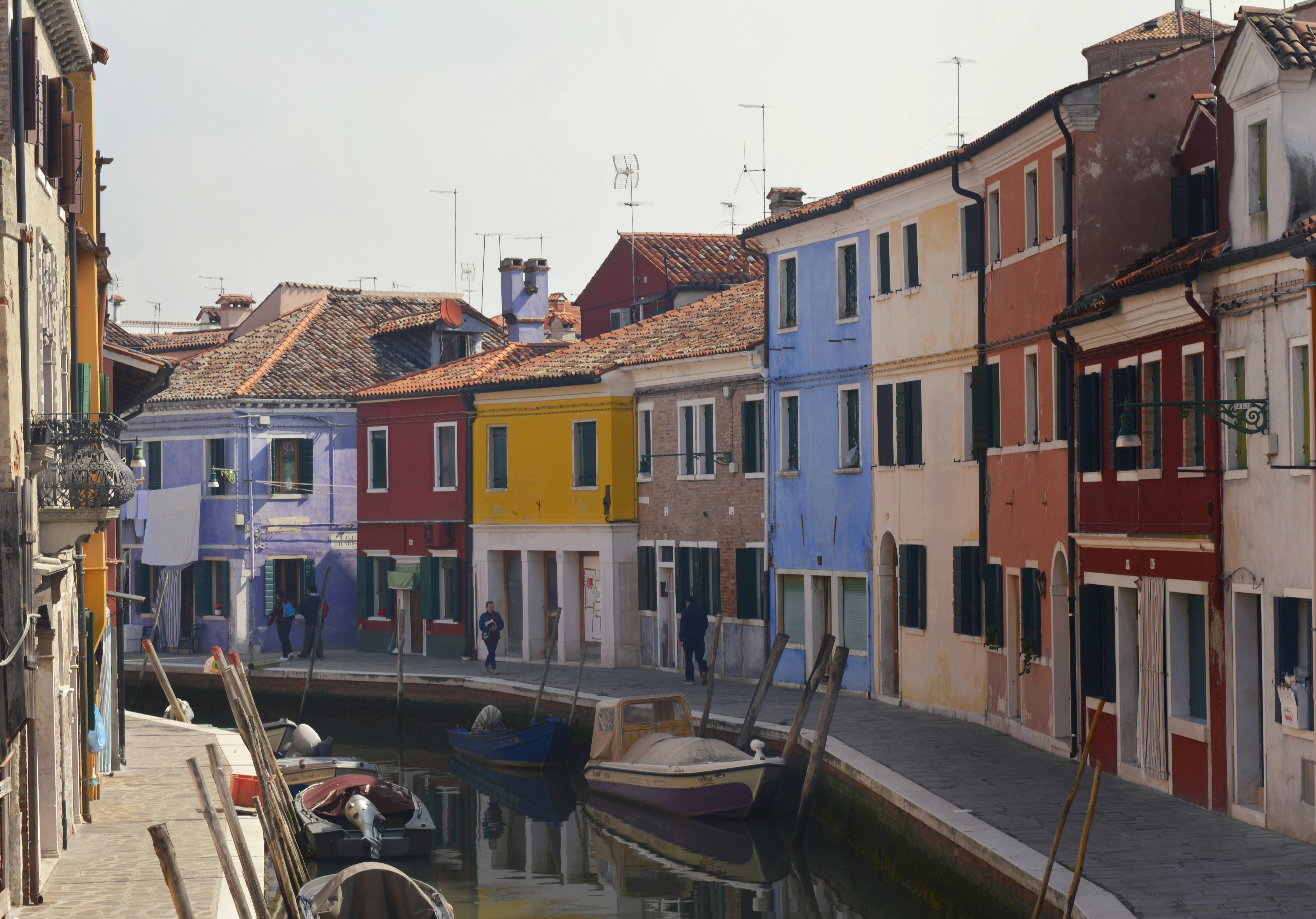 Red concrete house beside river photo – Free Burano Image on Unsplash
