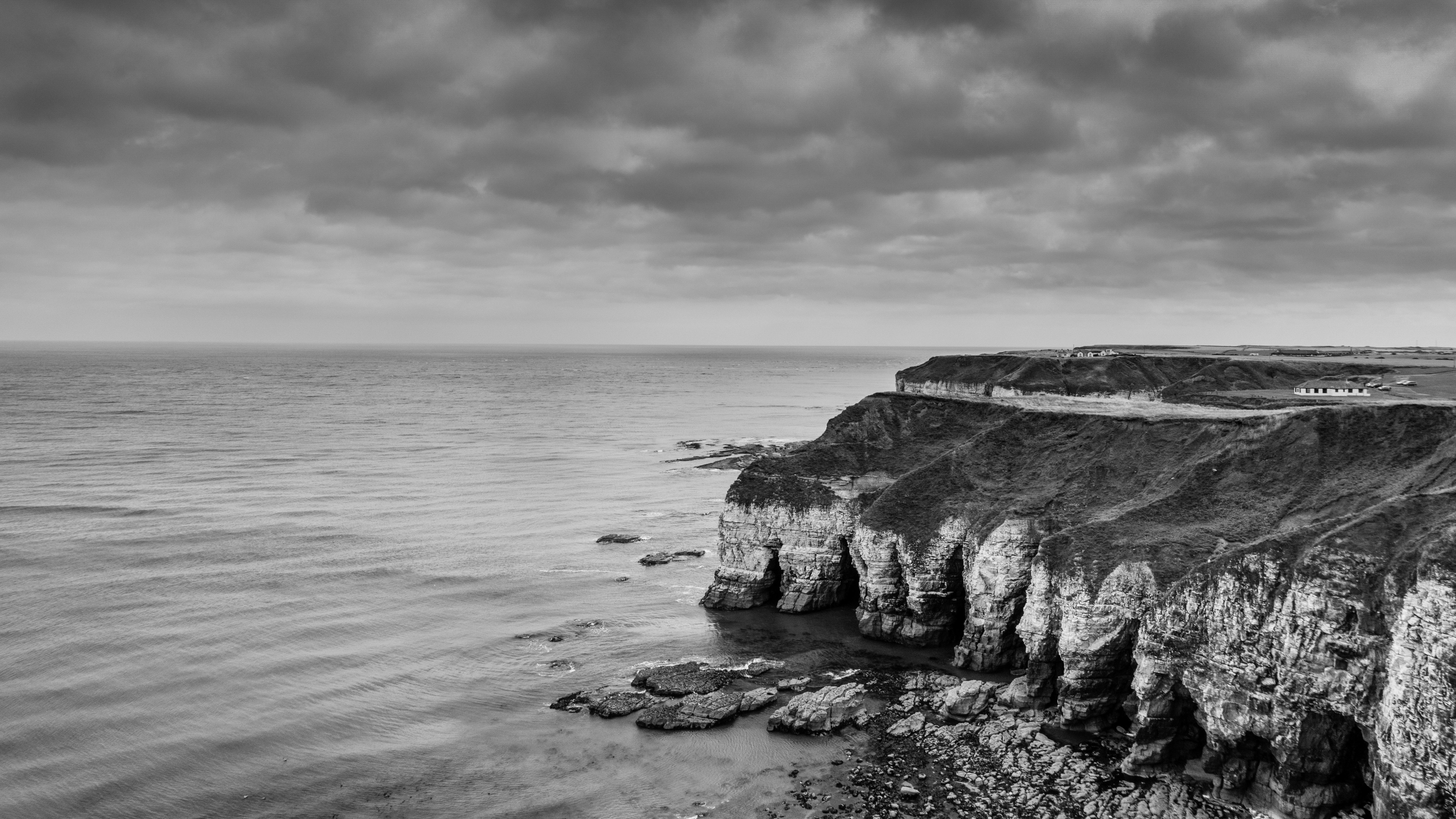 Grayscale og land near sea photo – Free Background Image on Unsplash