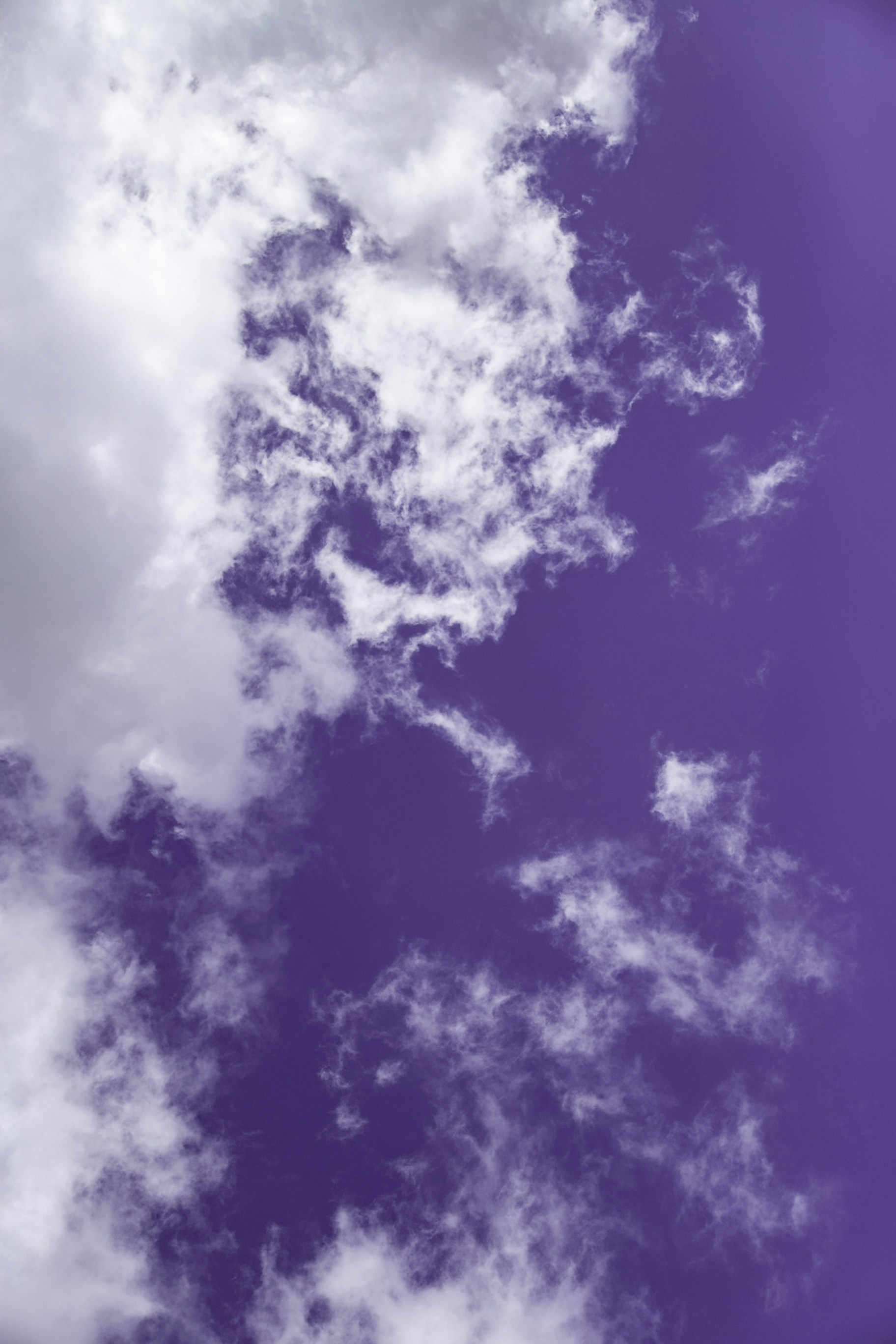 Lavender Veil: Cloud wisps drift beneath a violet sky