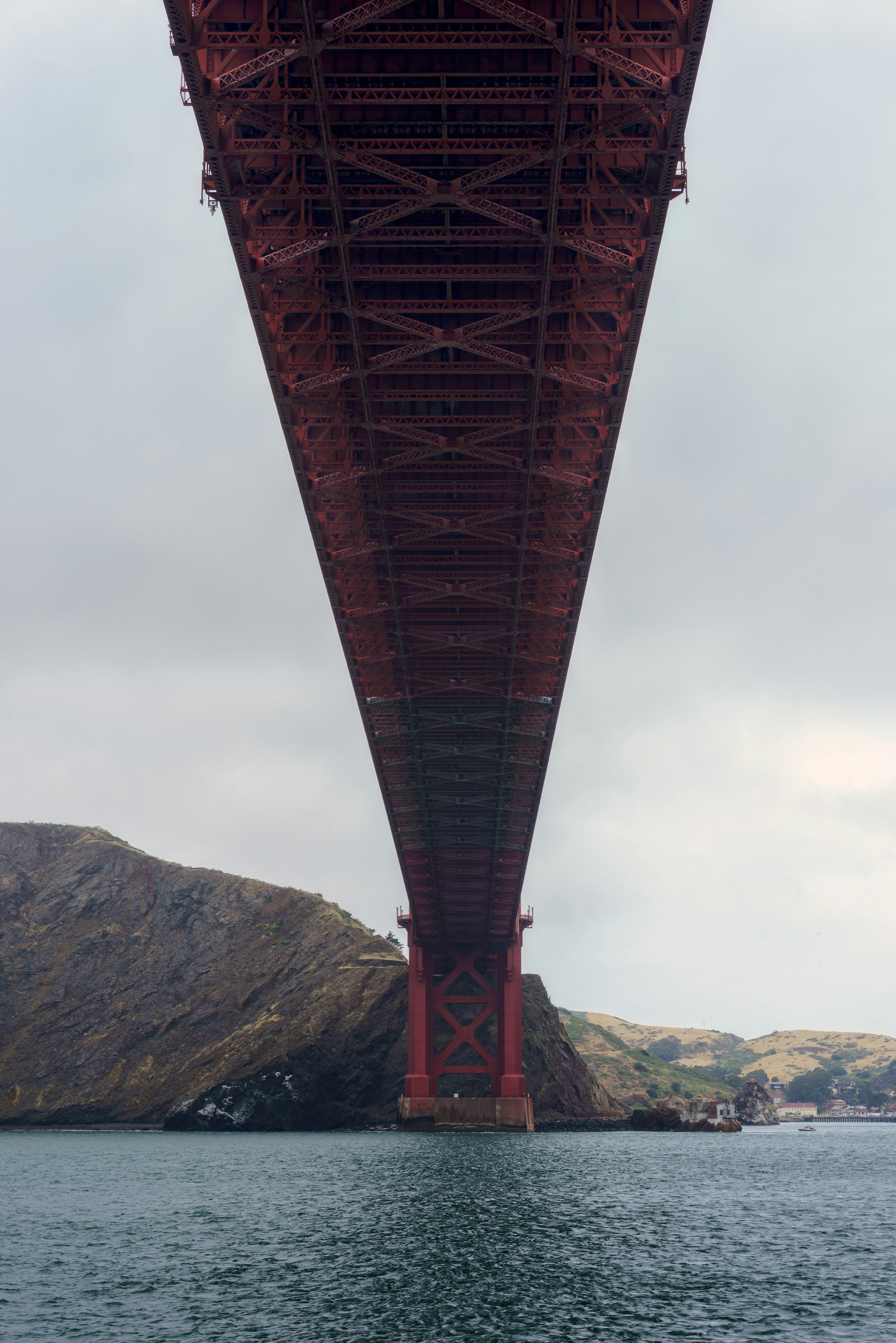 Under the Red Span: Geometry of Steel Over a Quiet Bay
