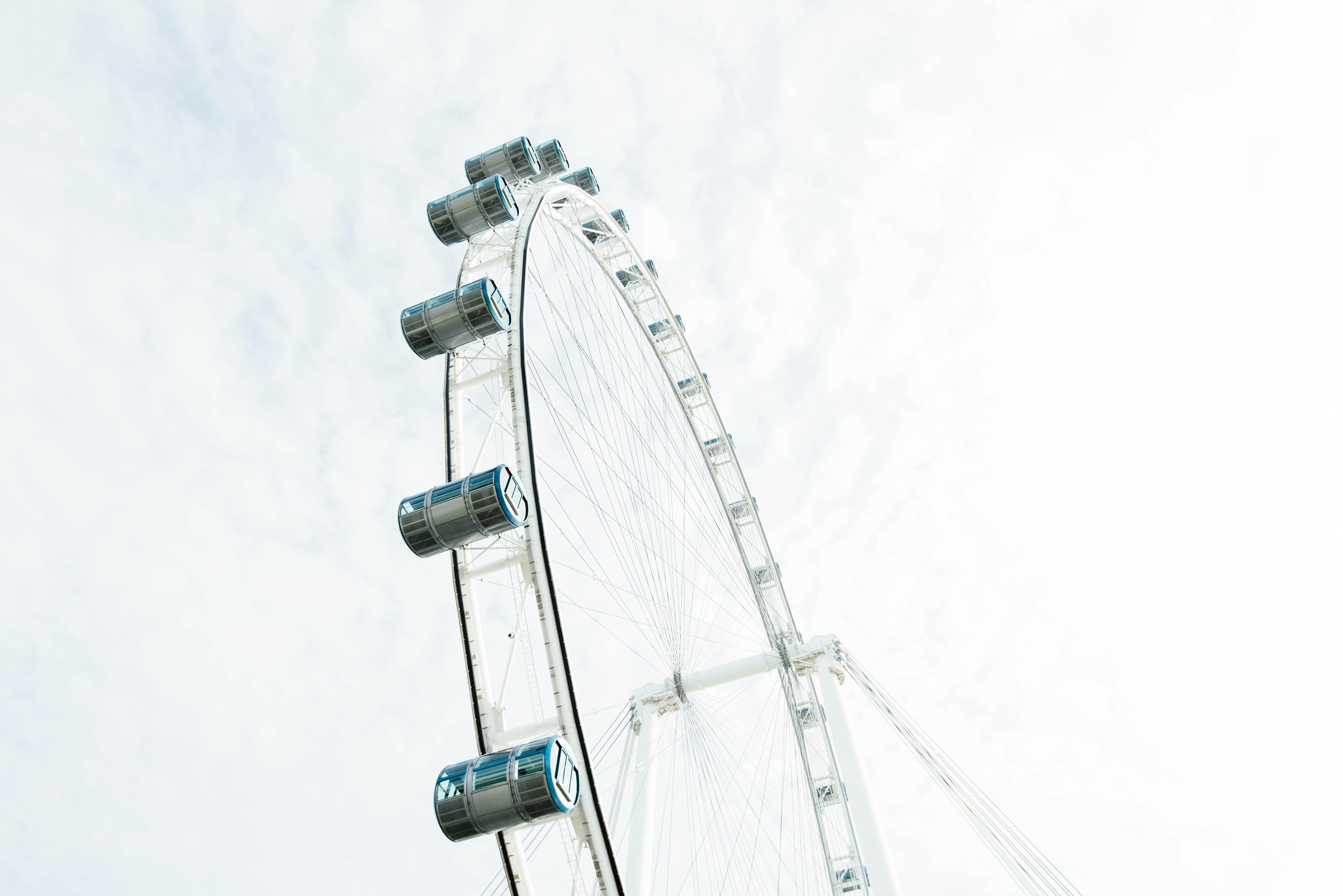 Edge of Light: A Ferris Wheel Reaching into a Bleached Sky