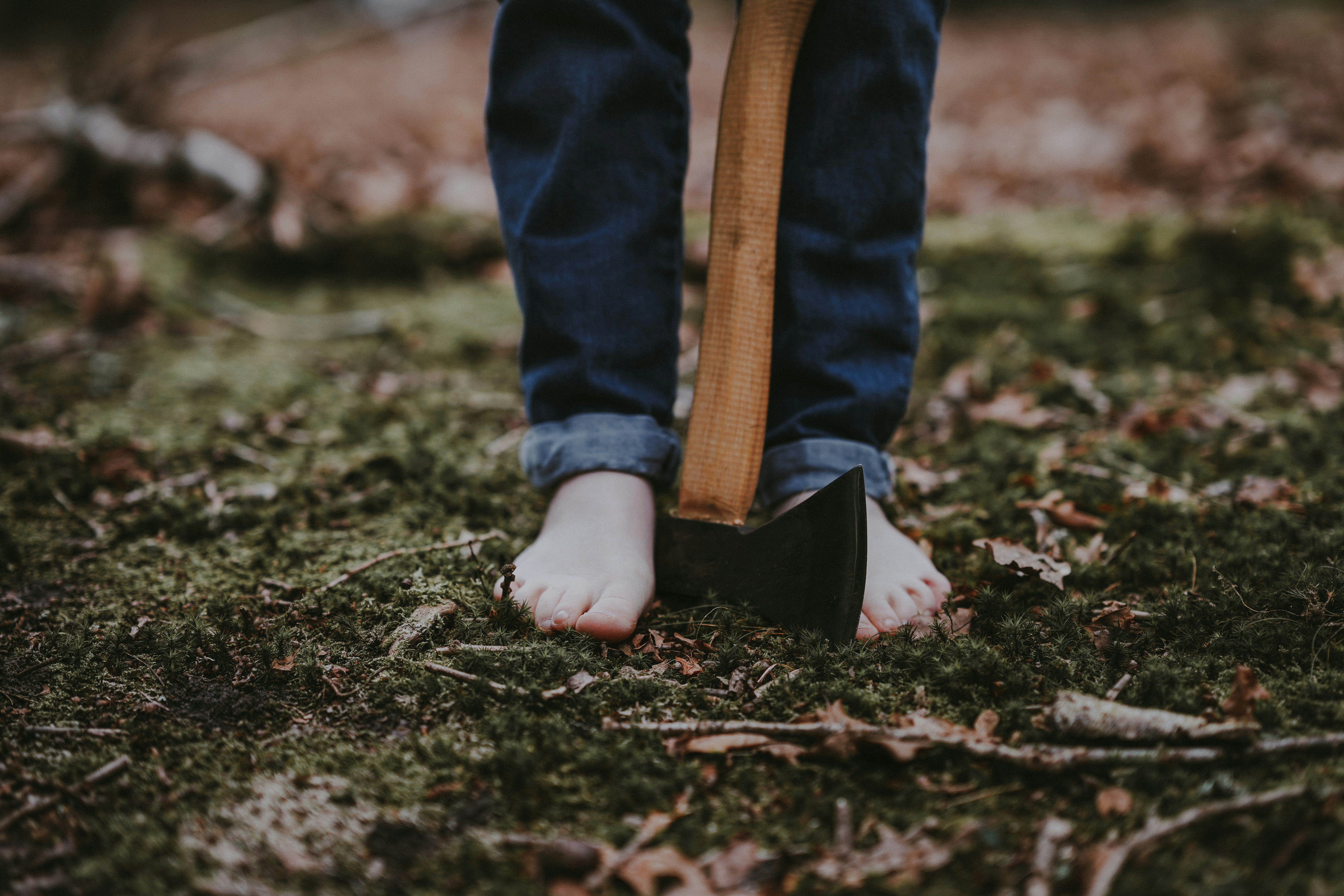 The Mossy Edge: Barefoot Pause with a Hatchet