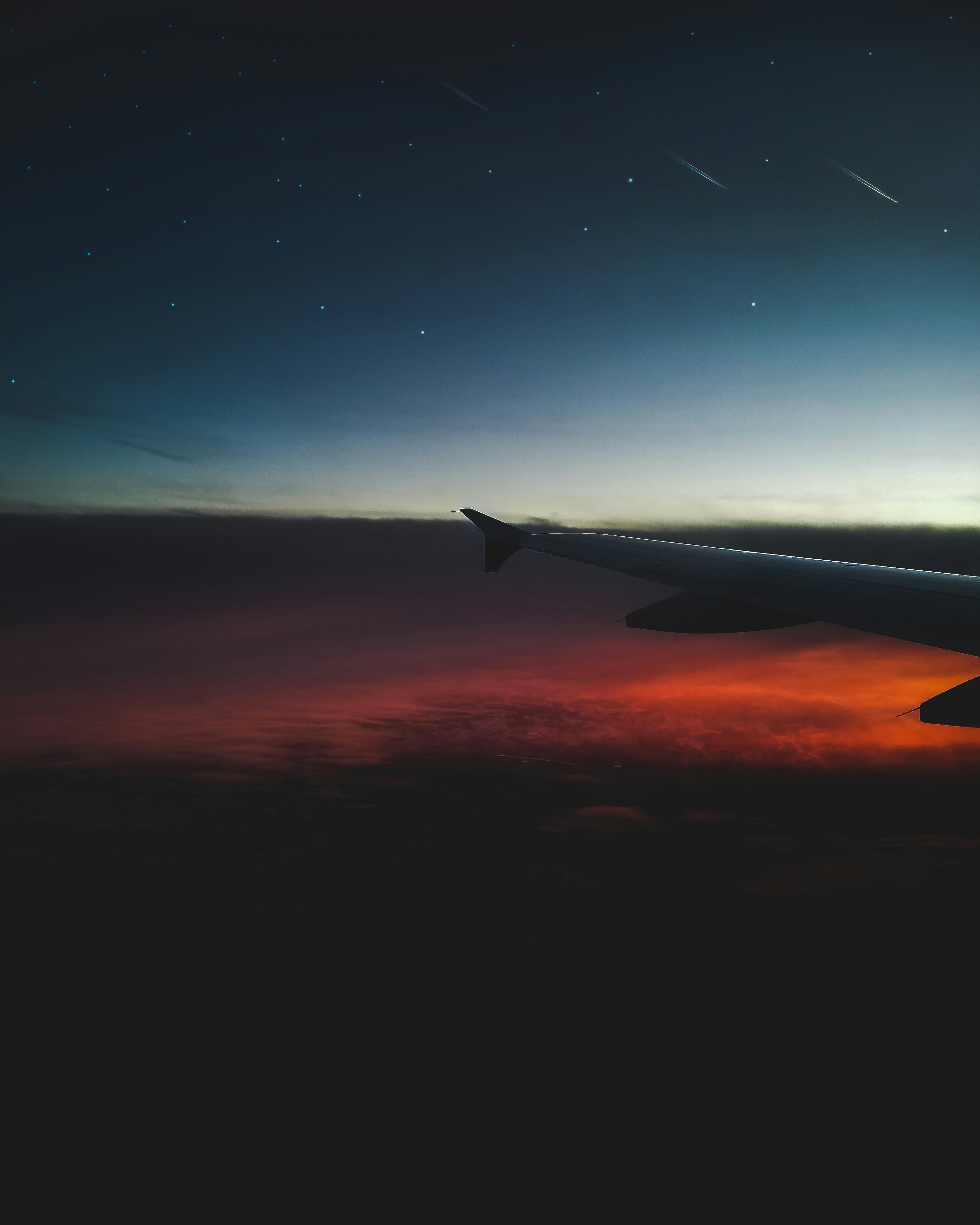 A view of the wing of an airplane at night photo – Free Sunset Image on ...