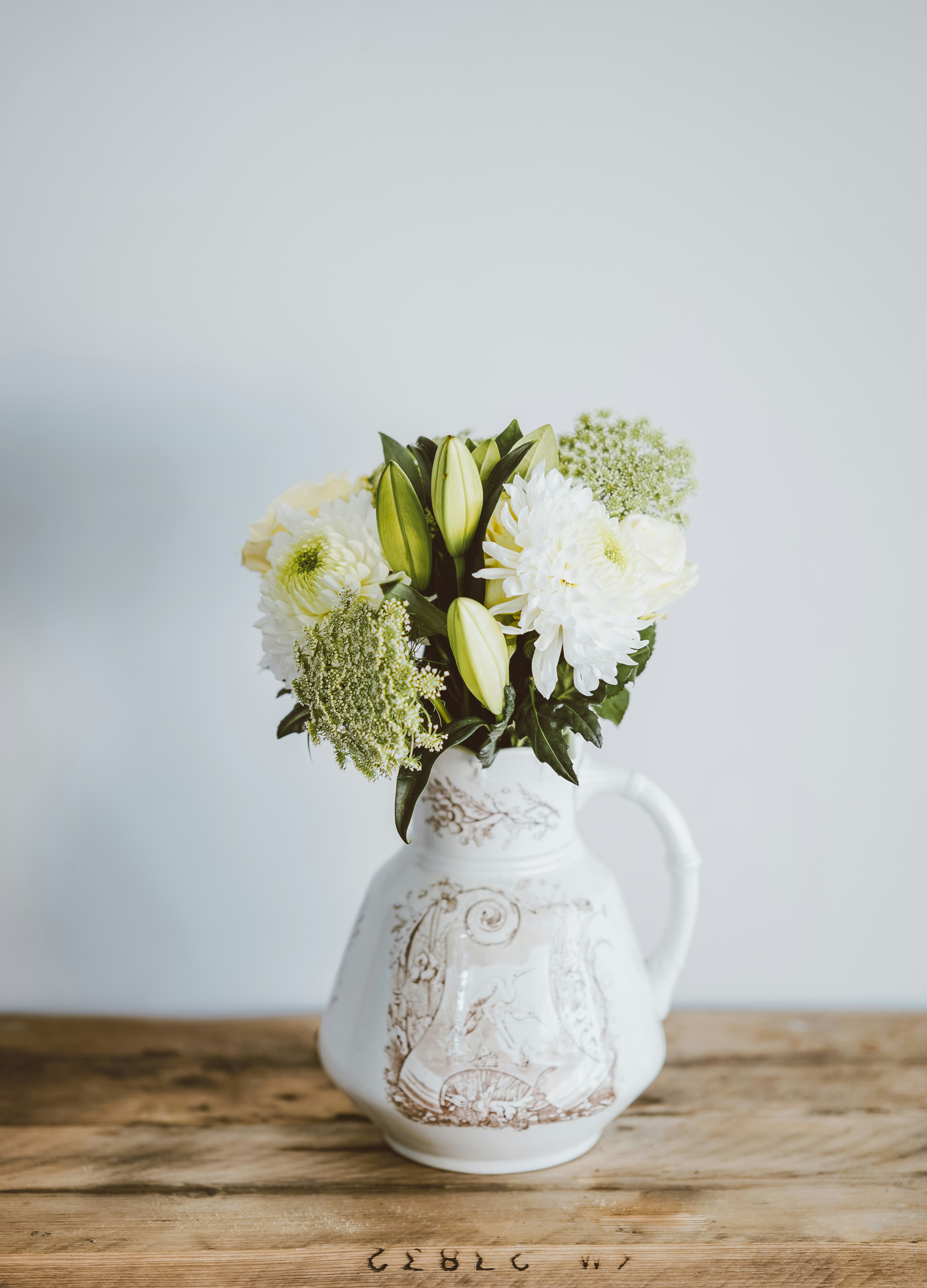 Flowers in pitcher vase photo – Free Plant Image on Unsplash