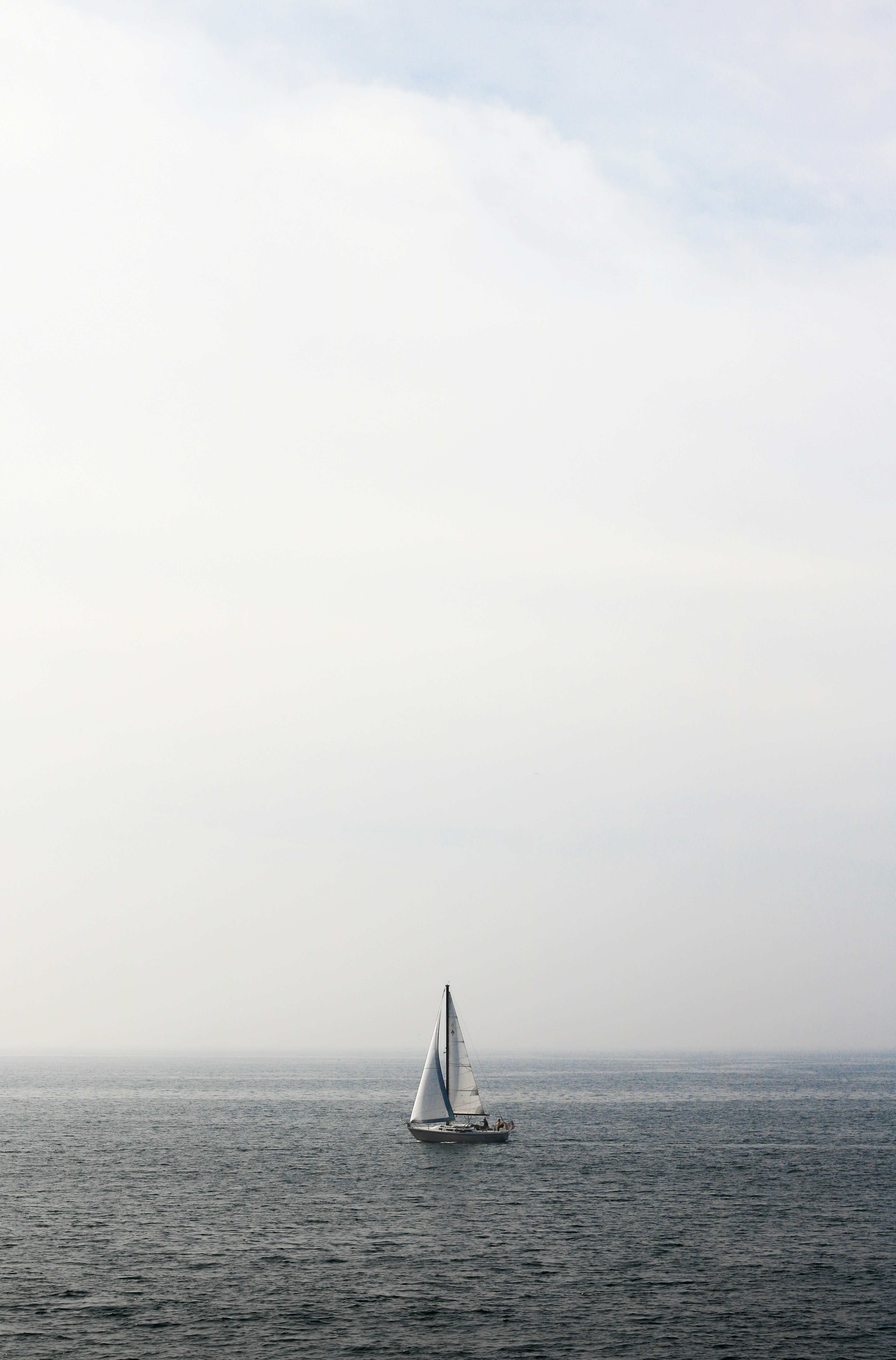 Boat sailing in body of water photo – Free Wallpaper Image on Unsplash