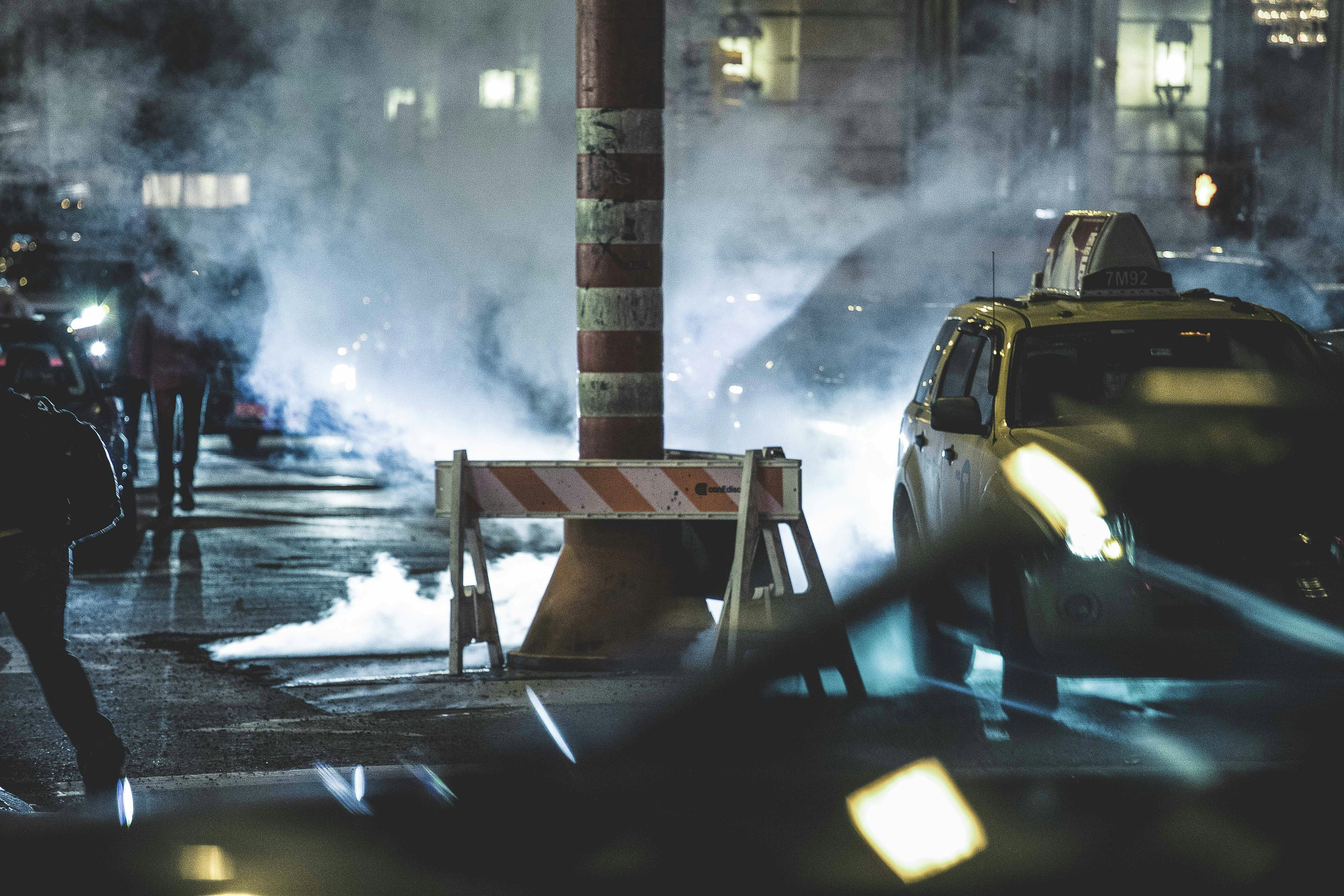 Midnight Neon Smoke and Barricade on a Dim Street
