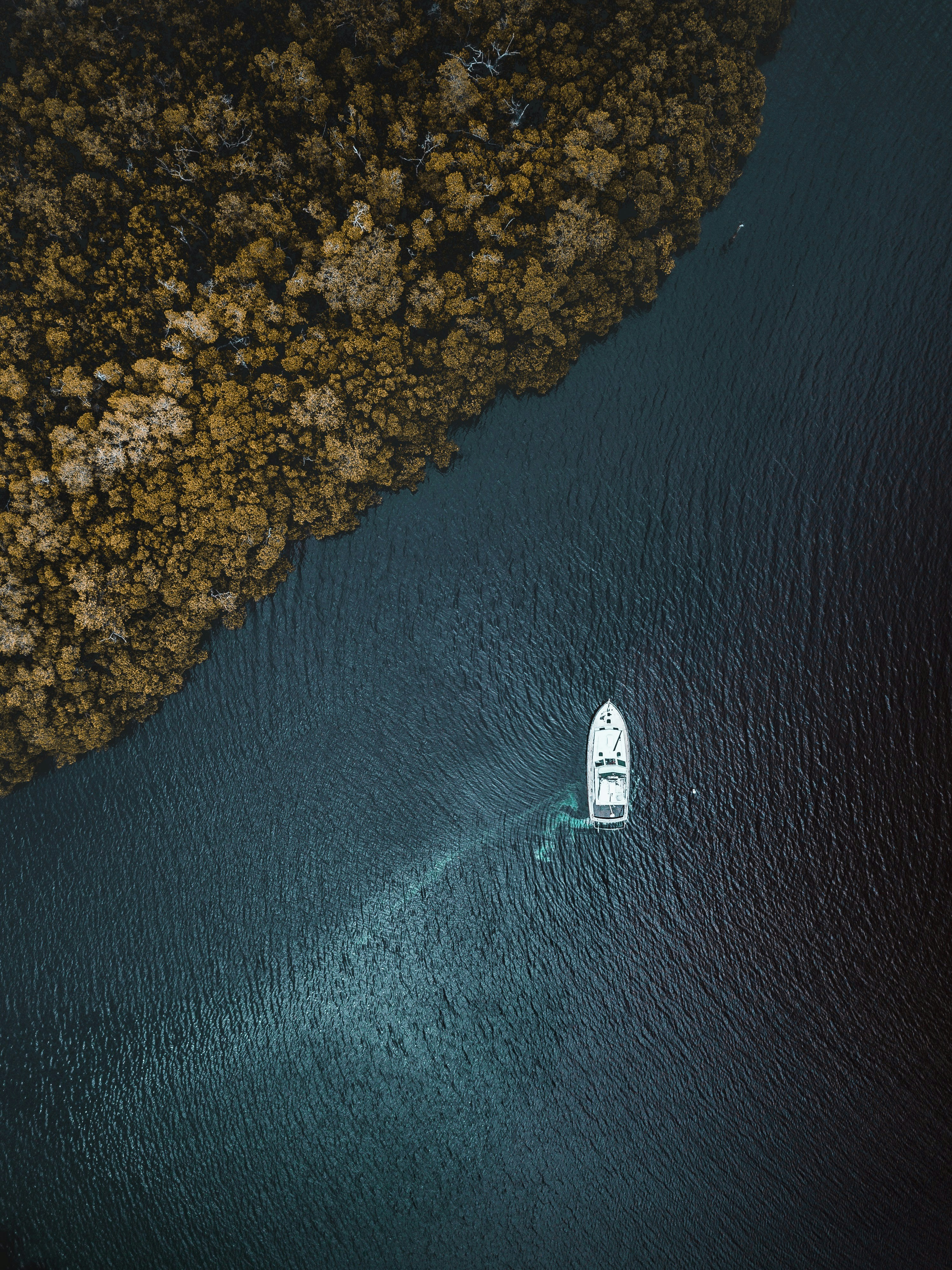 Bird's-eye view of boat on body of water photo – Free Aerial Image on ...