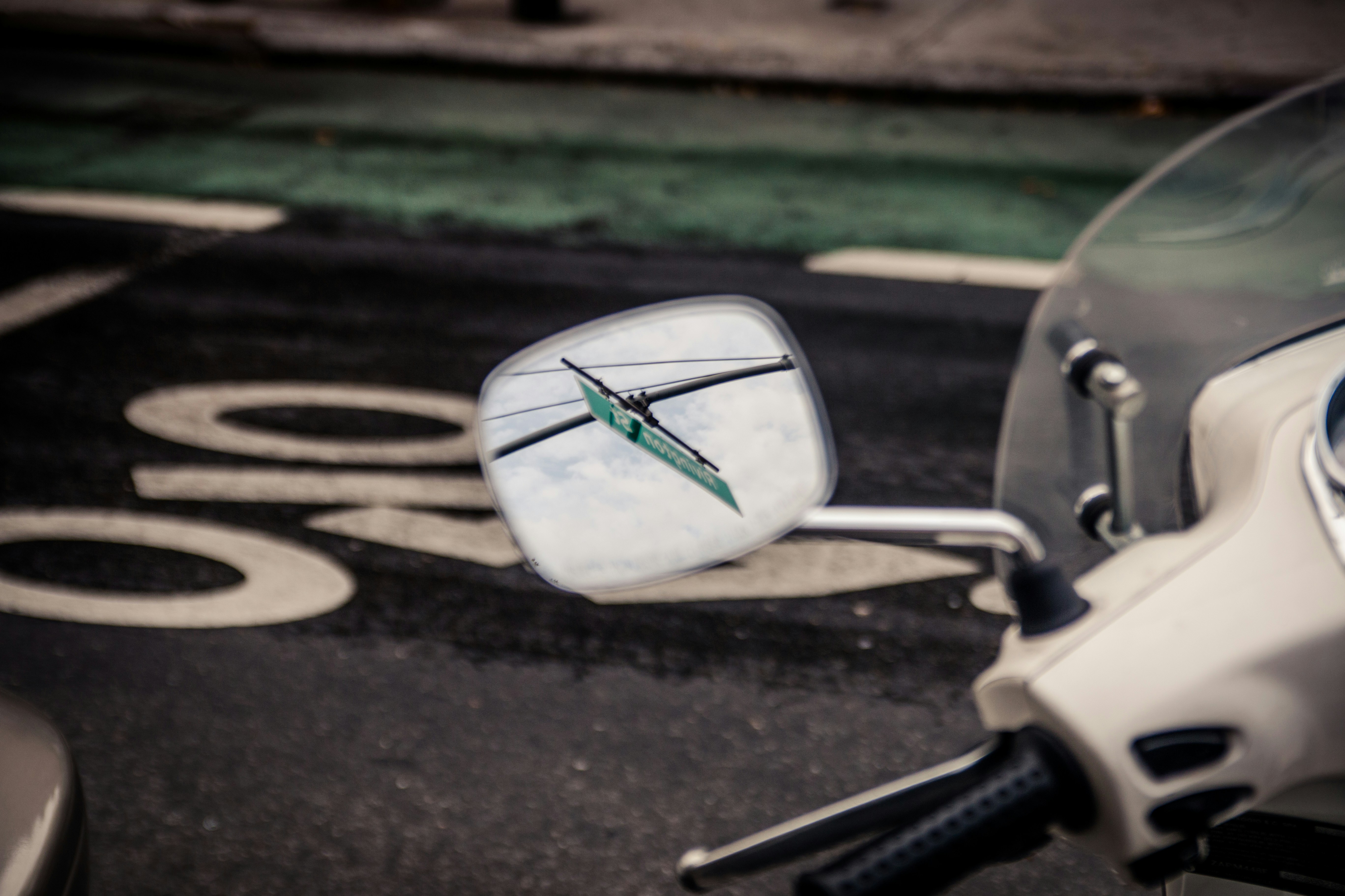 Winged Reflection in a City Mirror: Tiny Green Plane on a Dusky Street