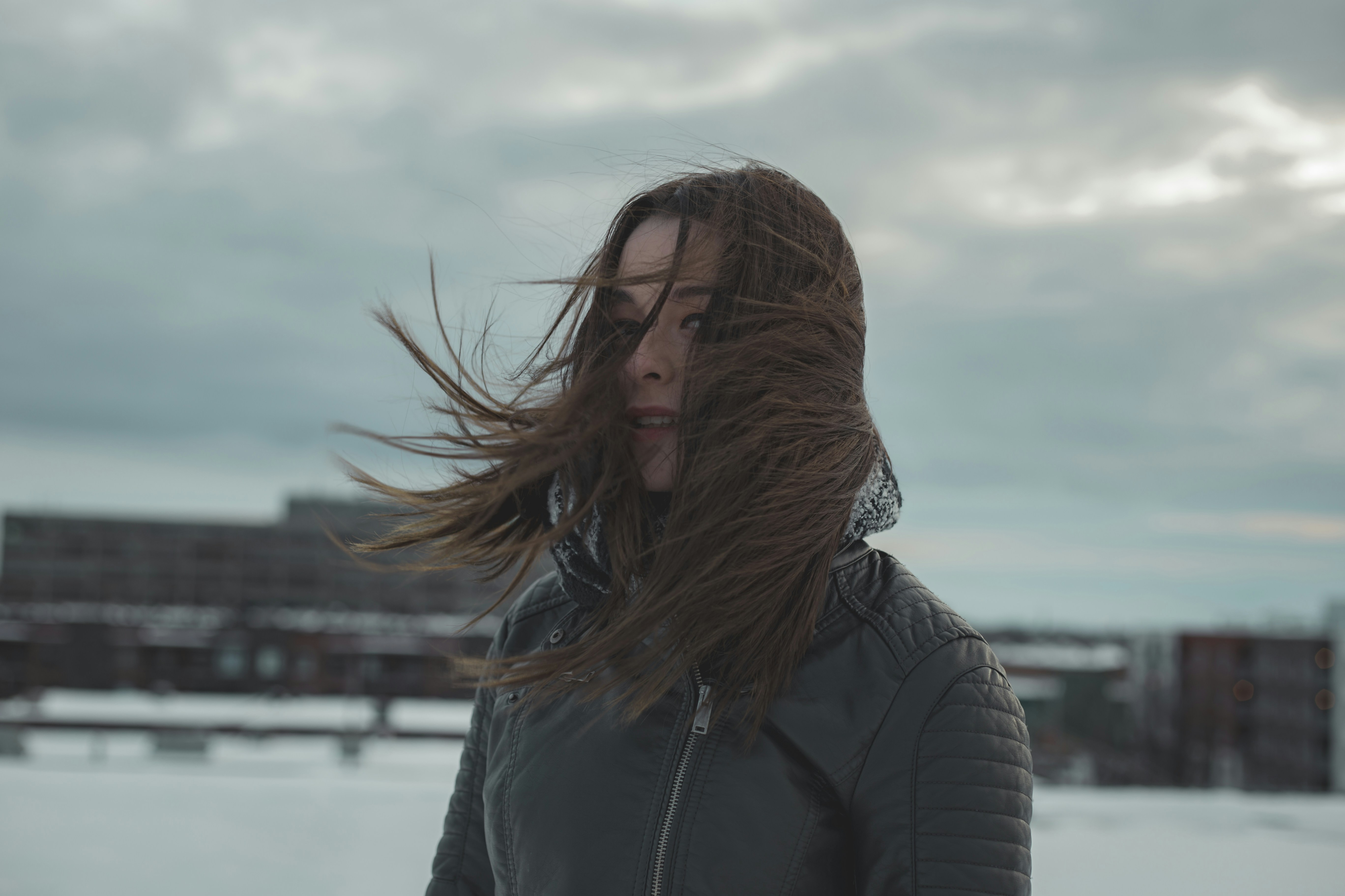 Woman standing while hair is blown by wind photo – Free Woman Image on ...