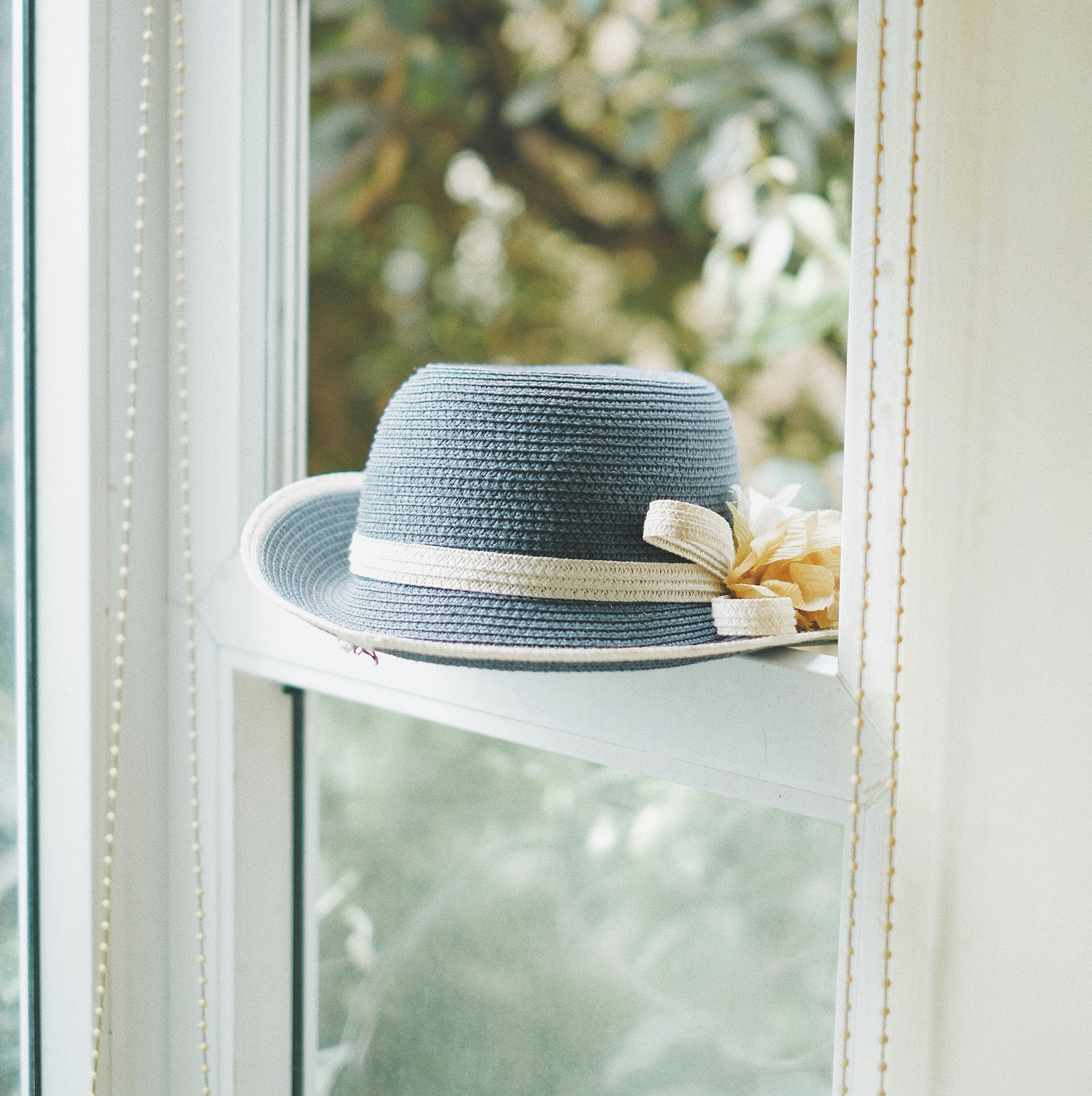 Grey knitted hat on window photo – Free Hat Image on Unsplash