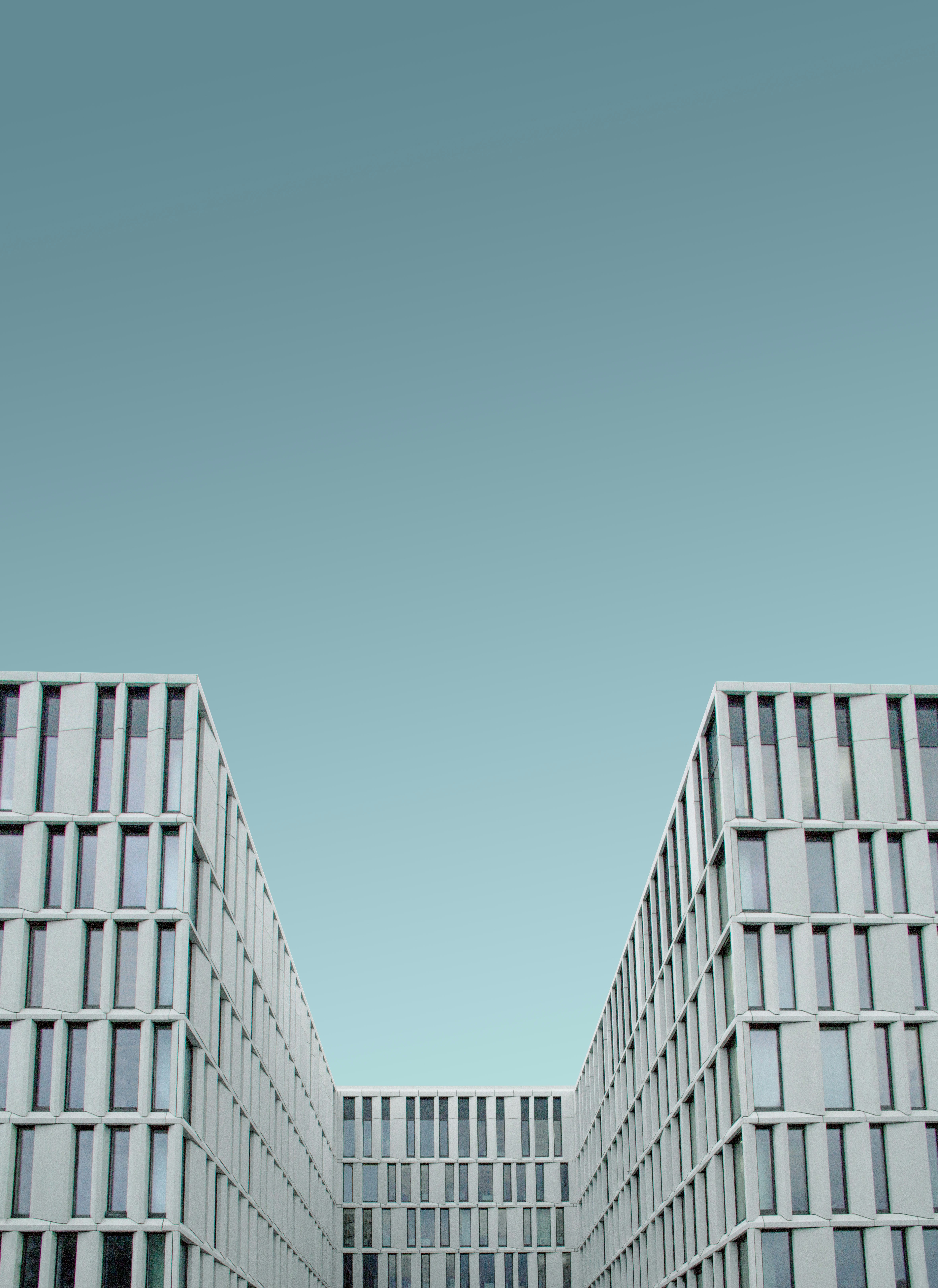 Man's eye view of white quadrangle building photo – Free Berlin Image ...