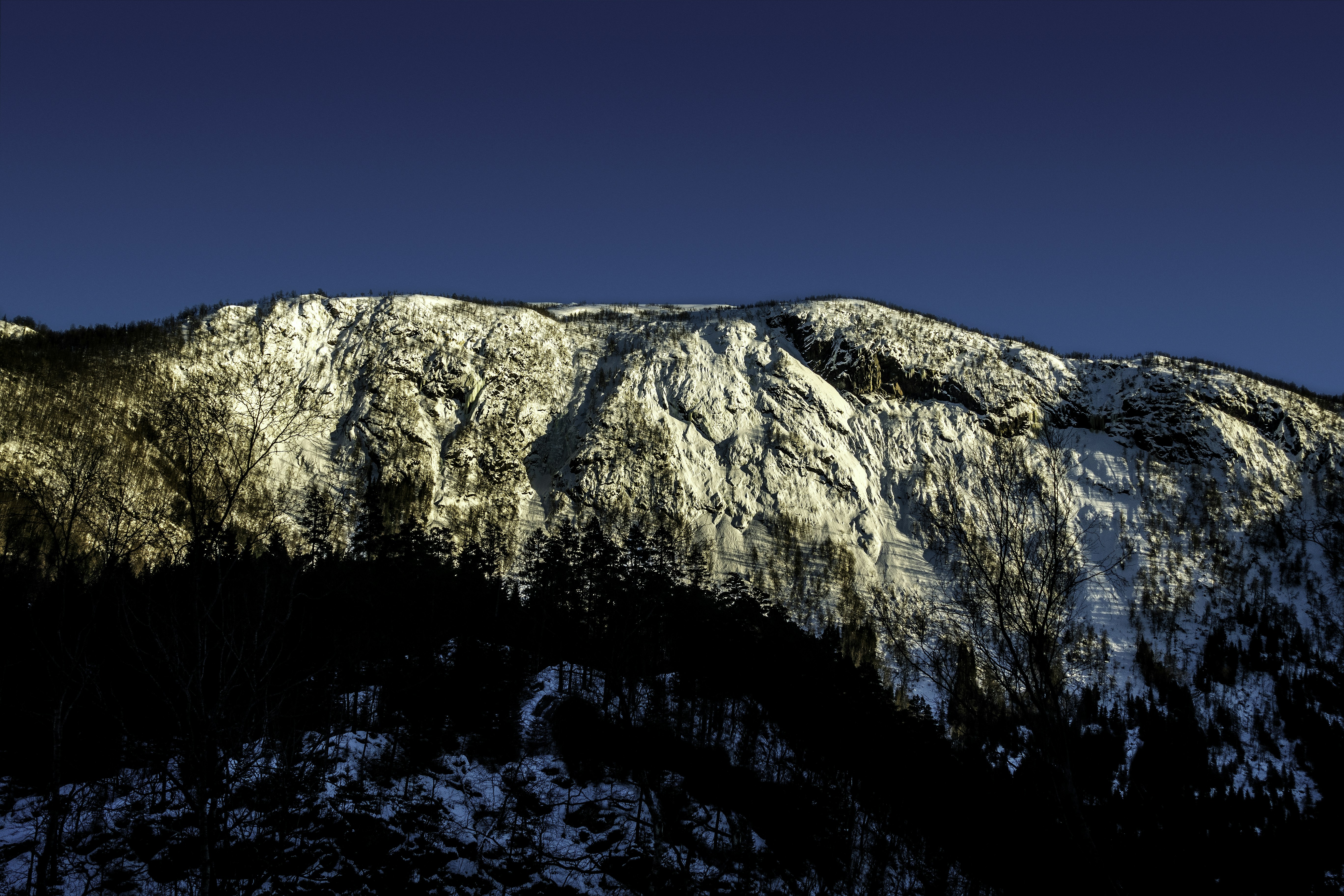 Golden Peaks Against Azure Skies