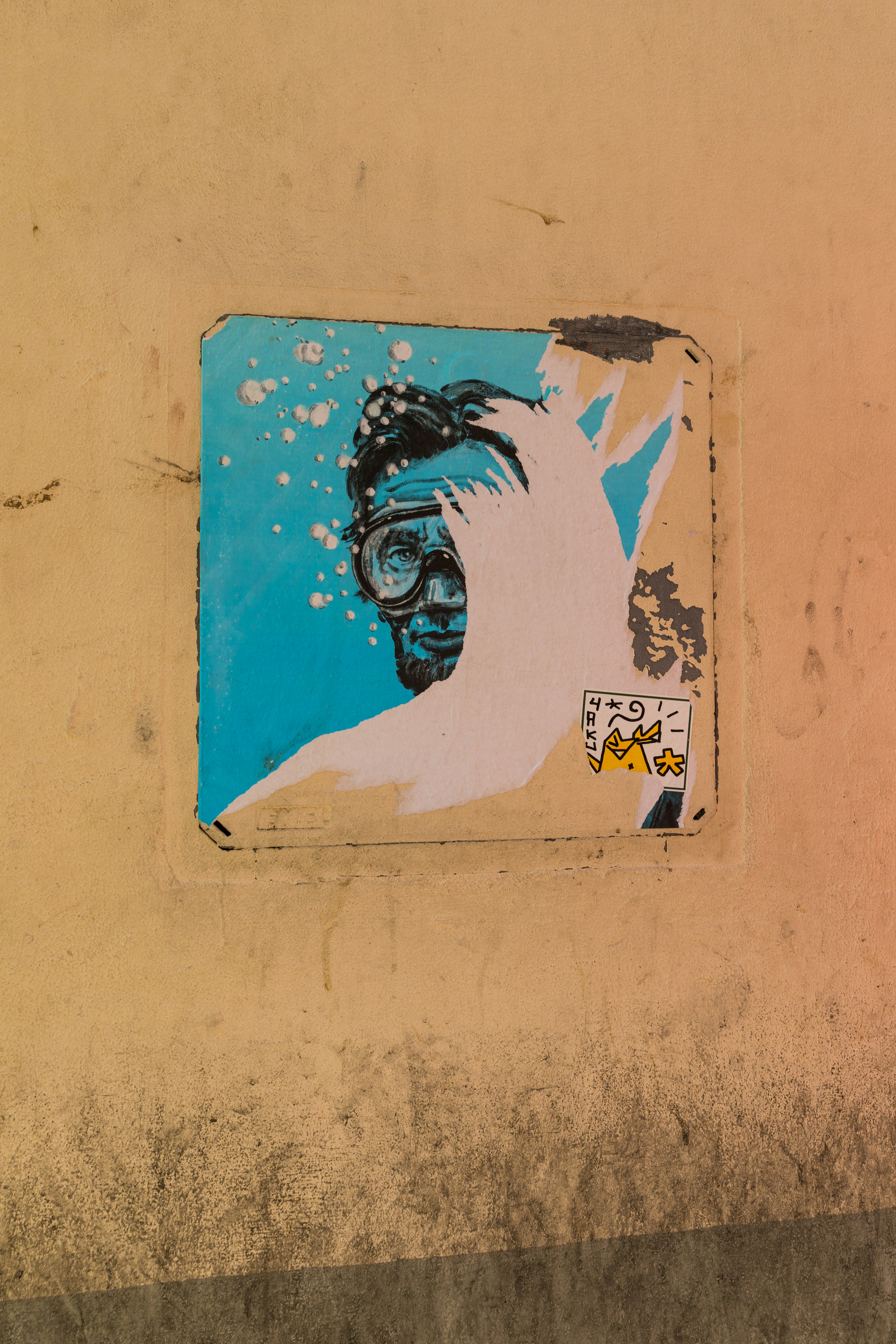 Diver in Street Blue: A Peel-Back Mural on a Peach Wall