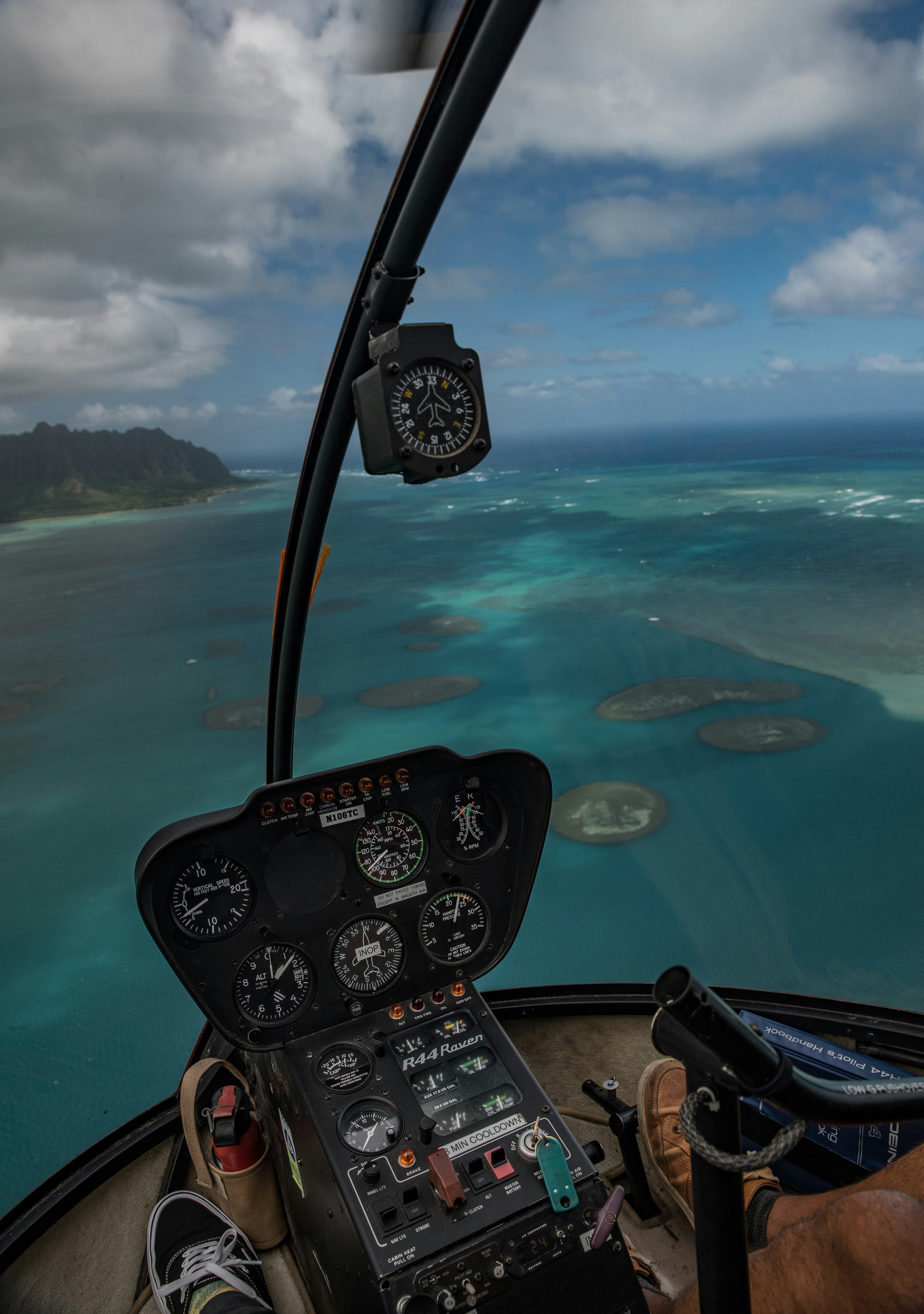 Cockpit Over Turquoise Expanse: Instruments Framing a Tropical Flyover