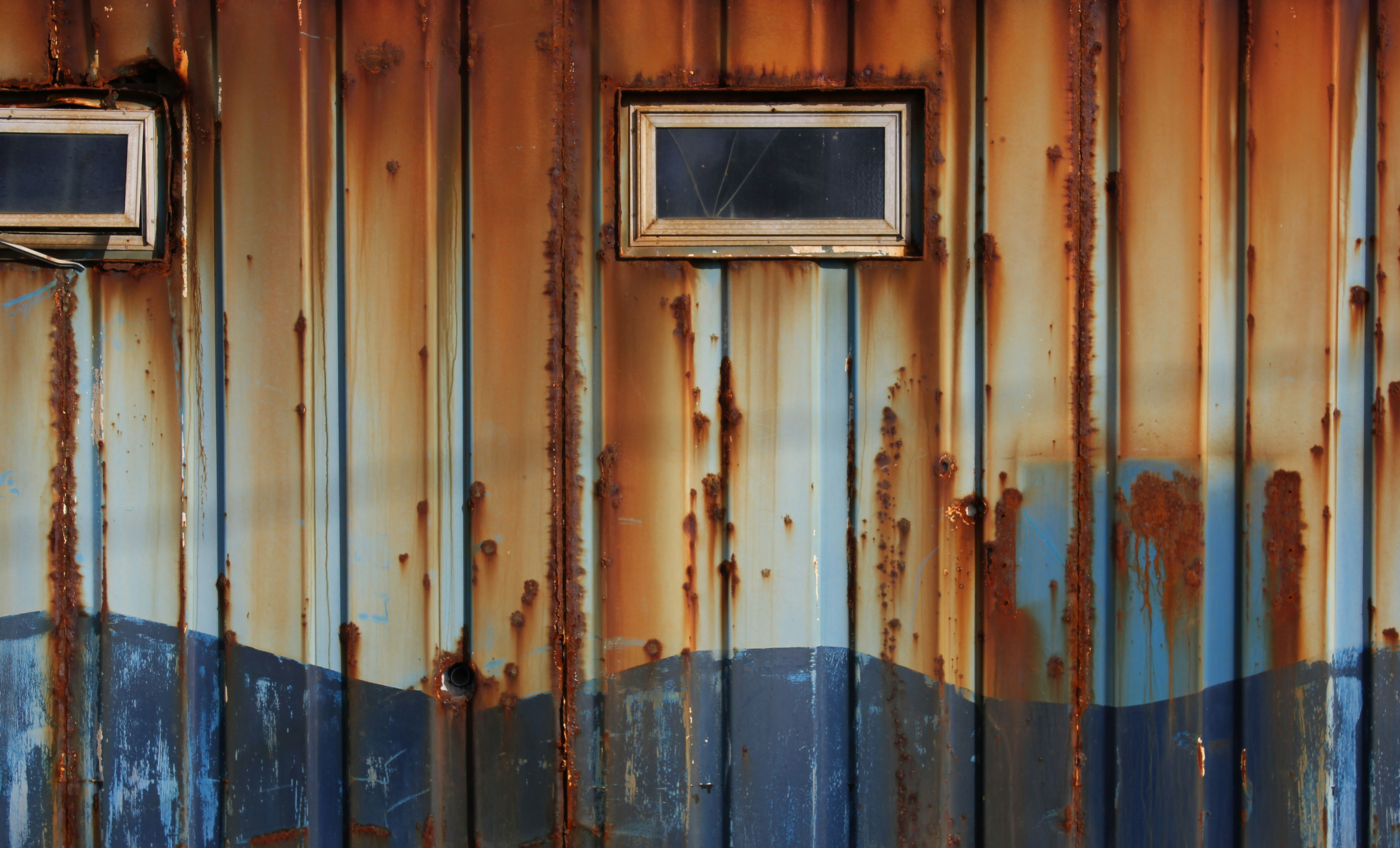 Metal wall with closed glass window photo – Free Doolin Image on Unsplash