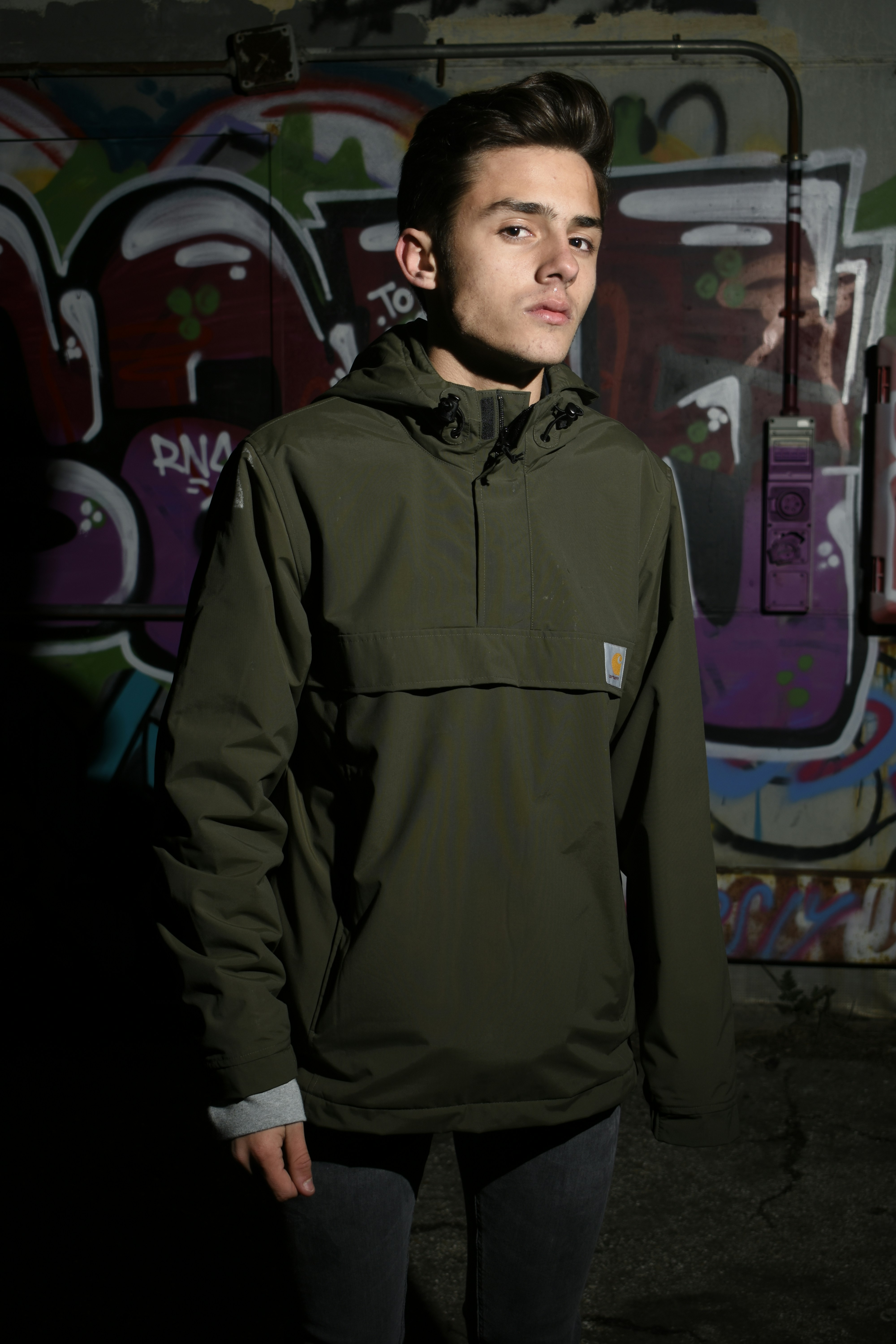 Graffiti Glow Portrait: A Quiet Stance Against Neon Walls