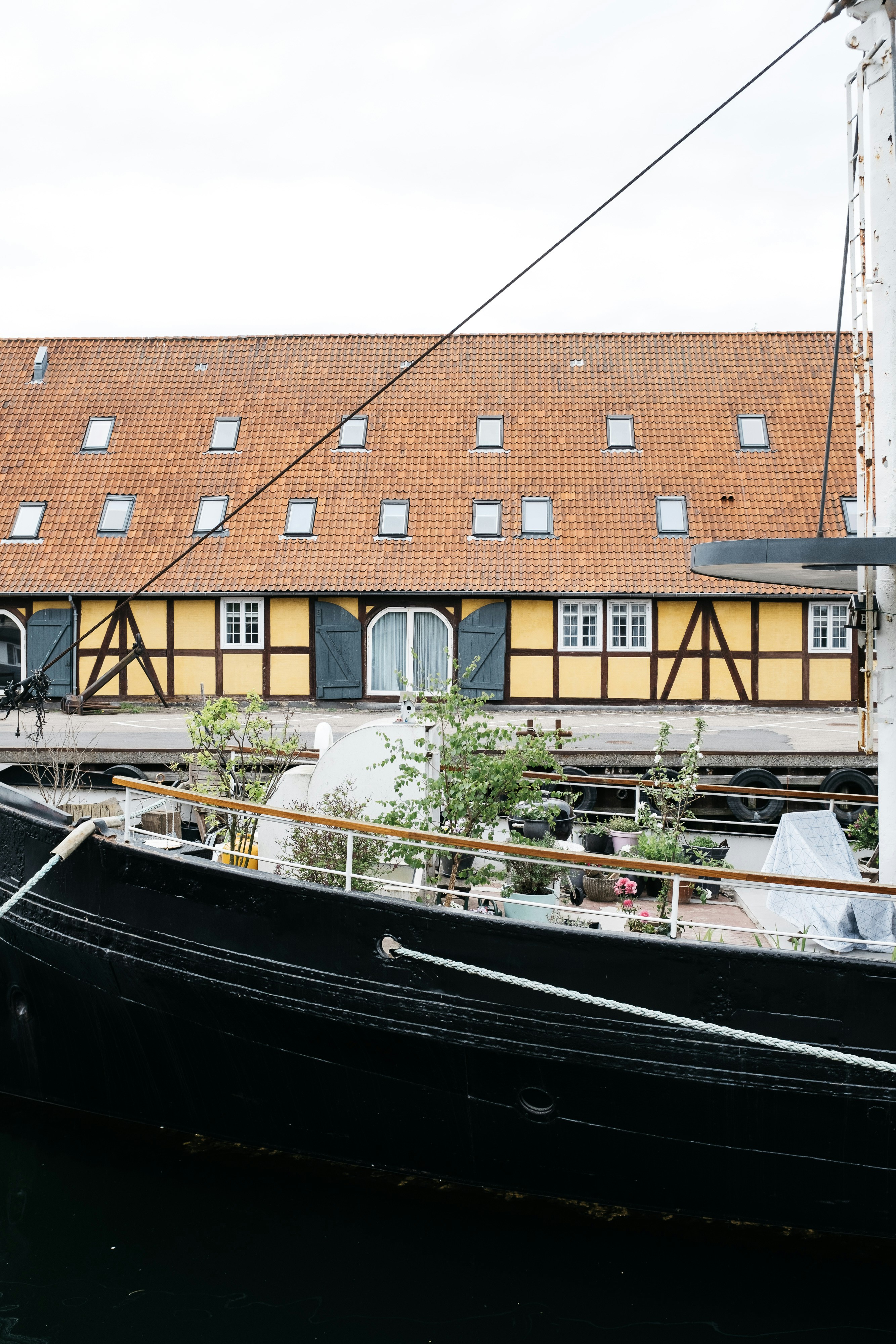 Canalfront Amber Timber: A Quiet Harbor Scene