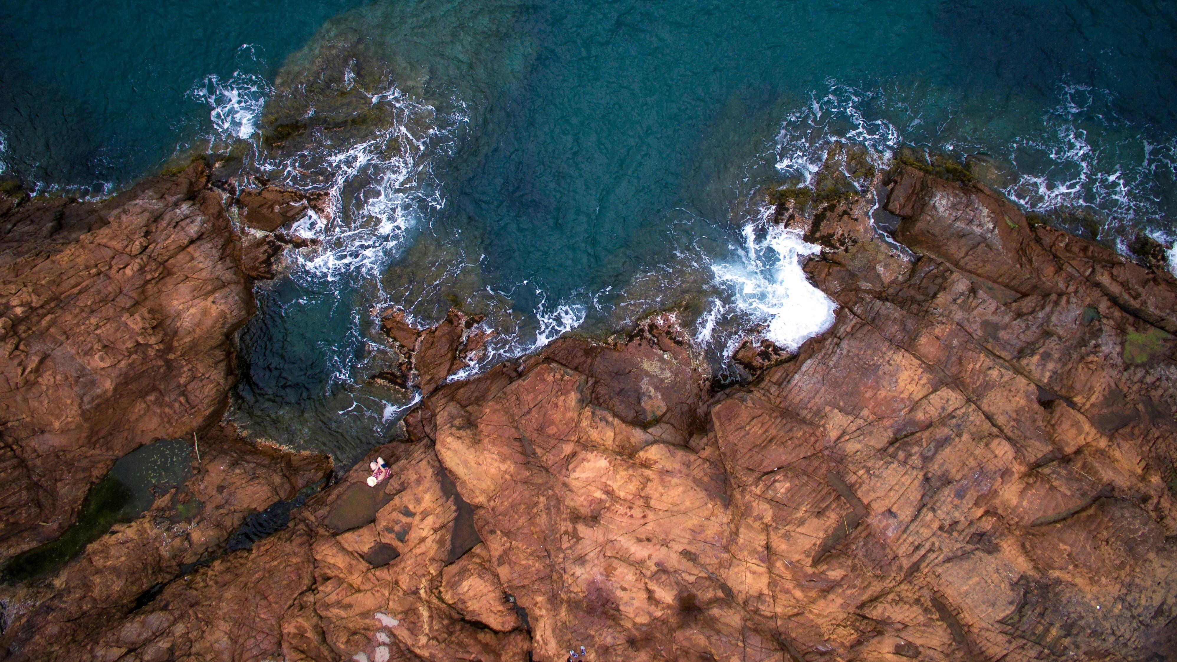bird's eye-view photography of cliff and body of water photo – Free ...