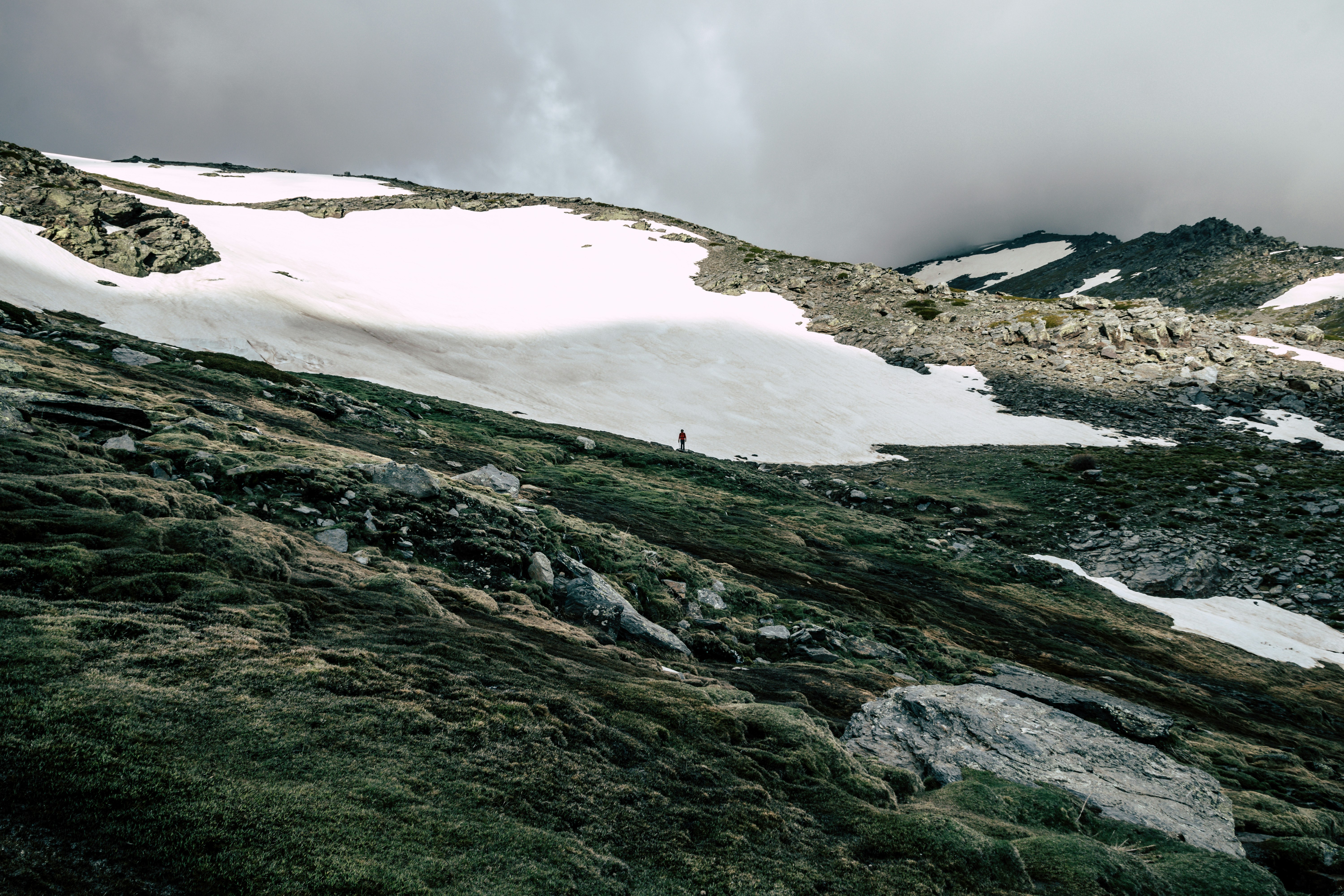 Snow covered mountain under grey sky photo – Free Mountain Image on ...