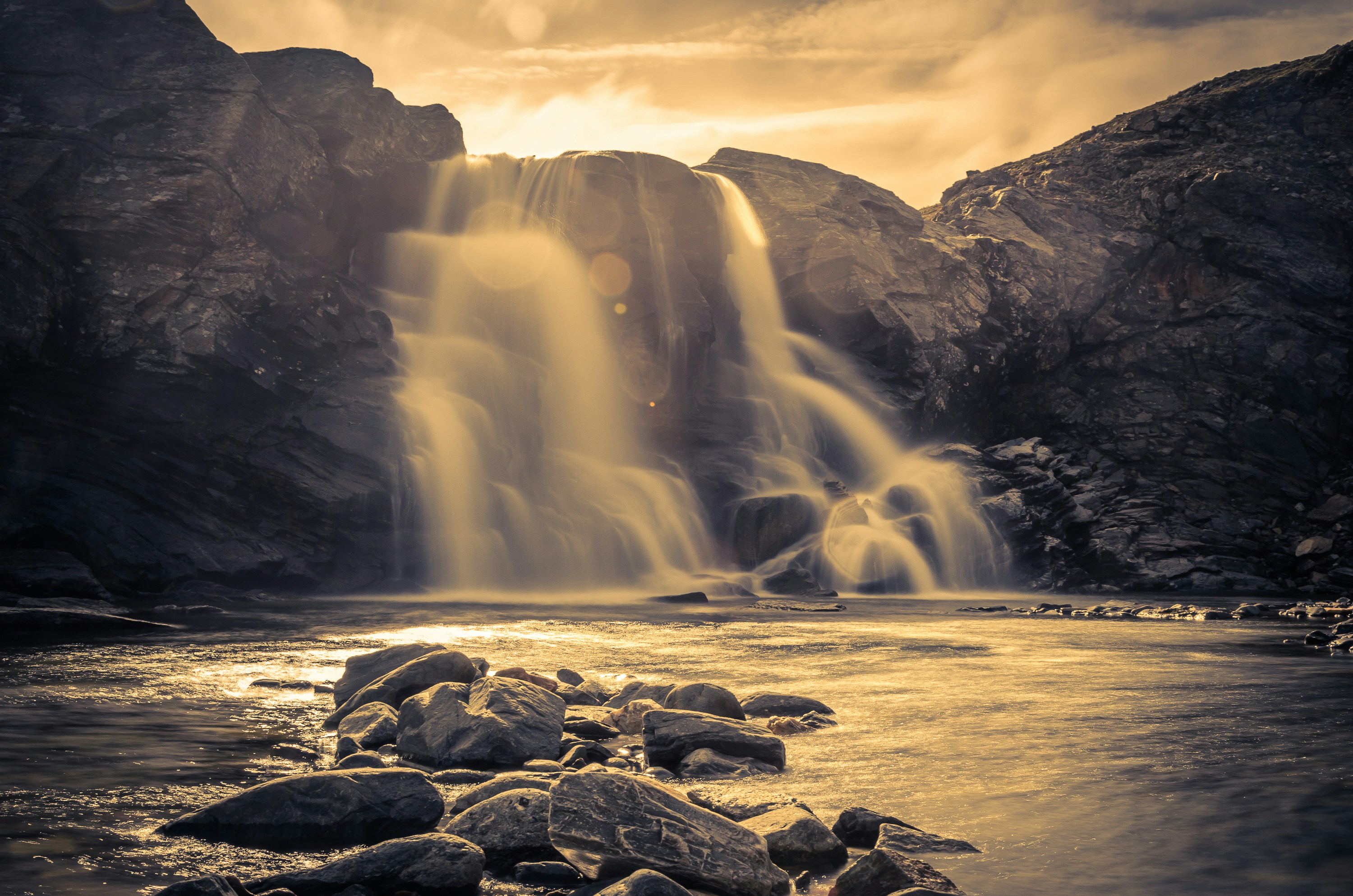 Golden Veil Over the Falls: A Quiet River Portrait